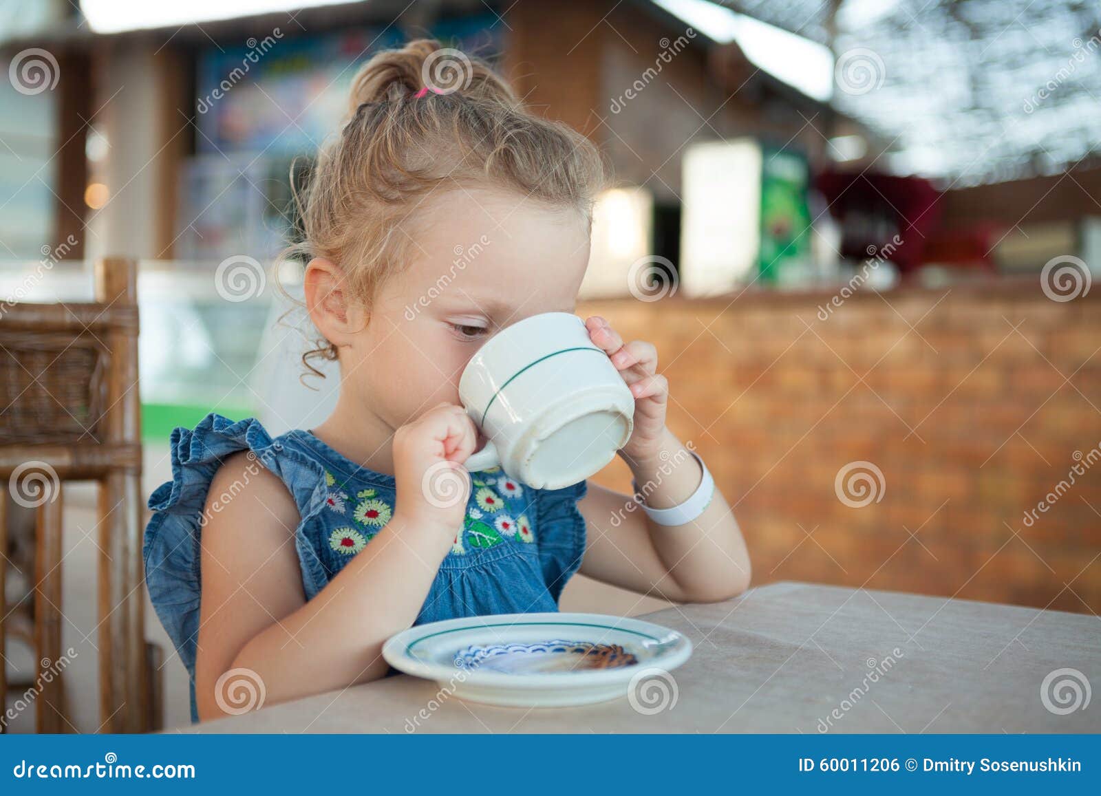 Little Girl Drinking Tea from a Cup Stock Photo - Image of girl, spoon ...