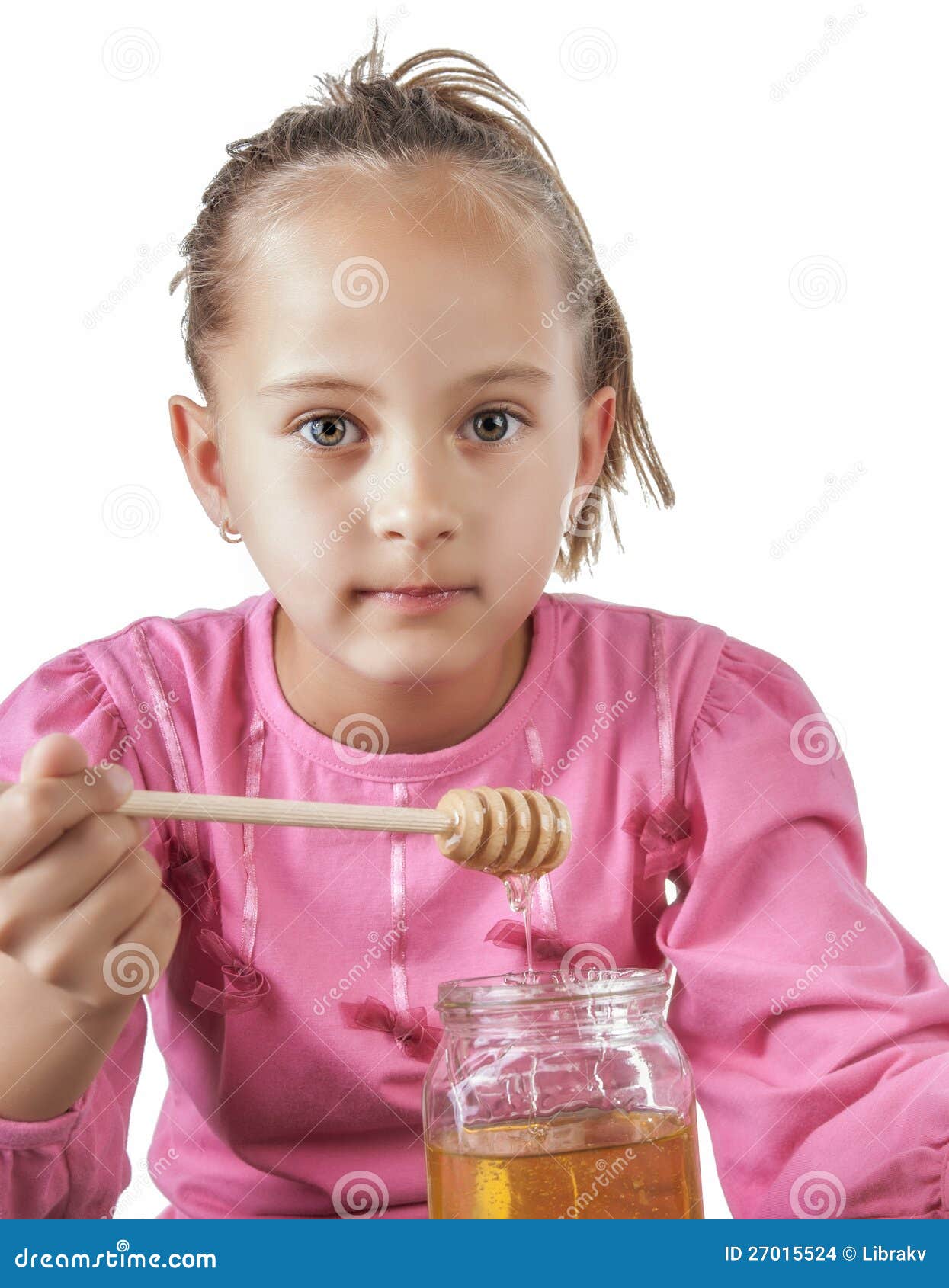 Little girl eat honey stock photo. Image of nutrition - 27015524