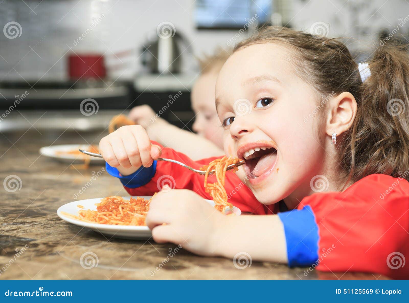 Little Girl Eat Pasta in the Kitchen Table Stock Image - Image of child ...