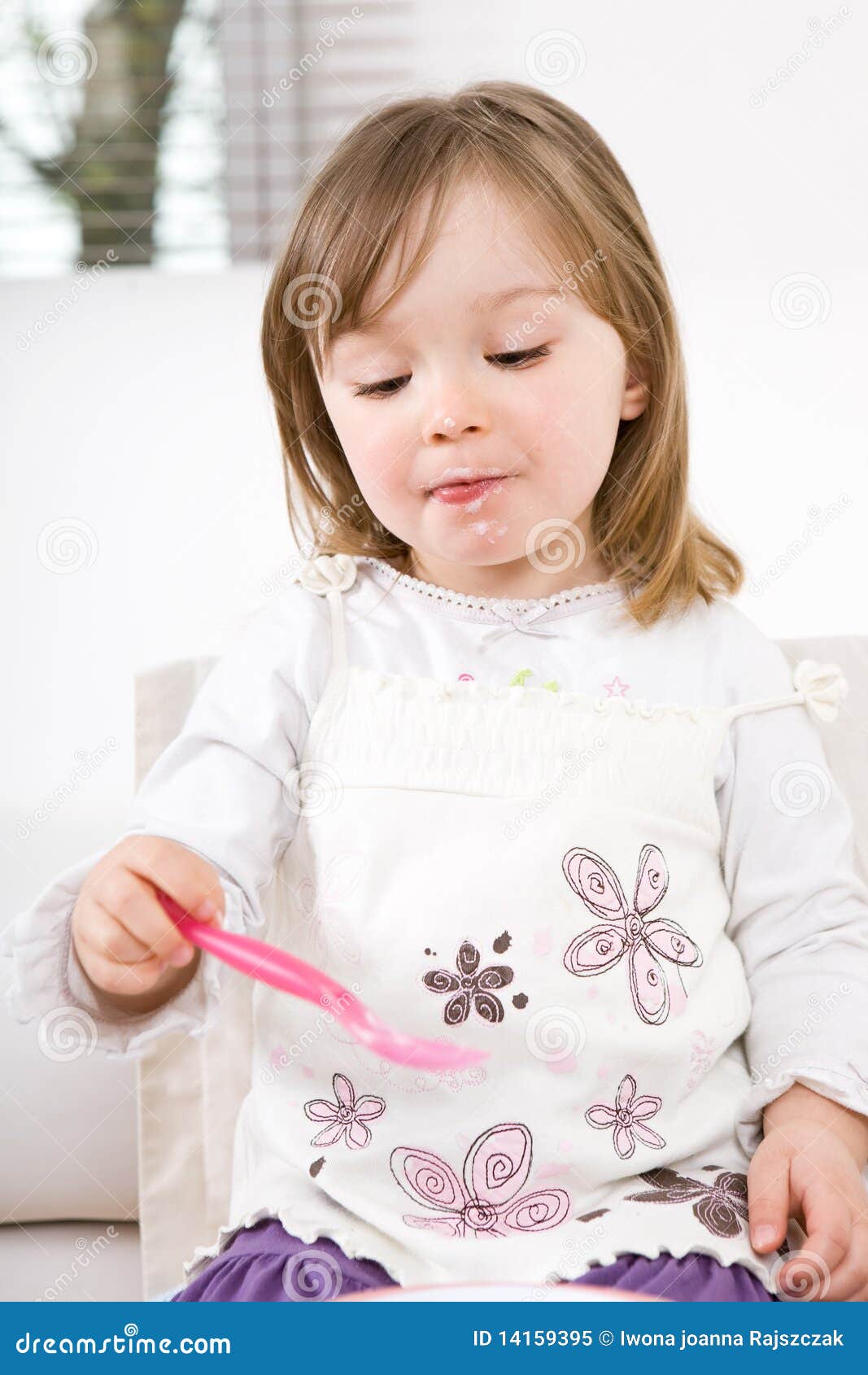Little girl eating stock image. Image of portrait, lifestyle - 14159395