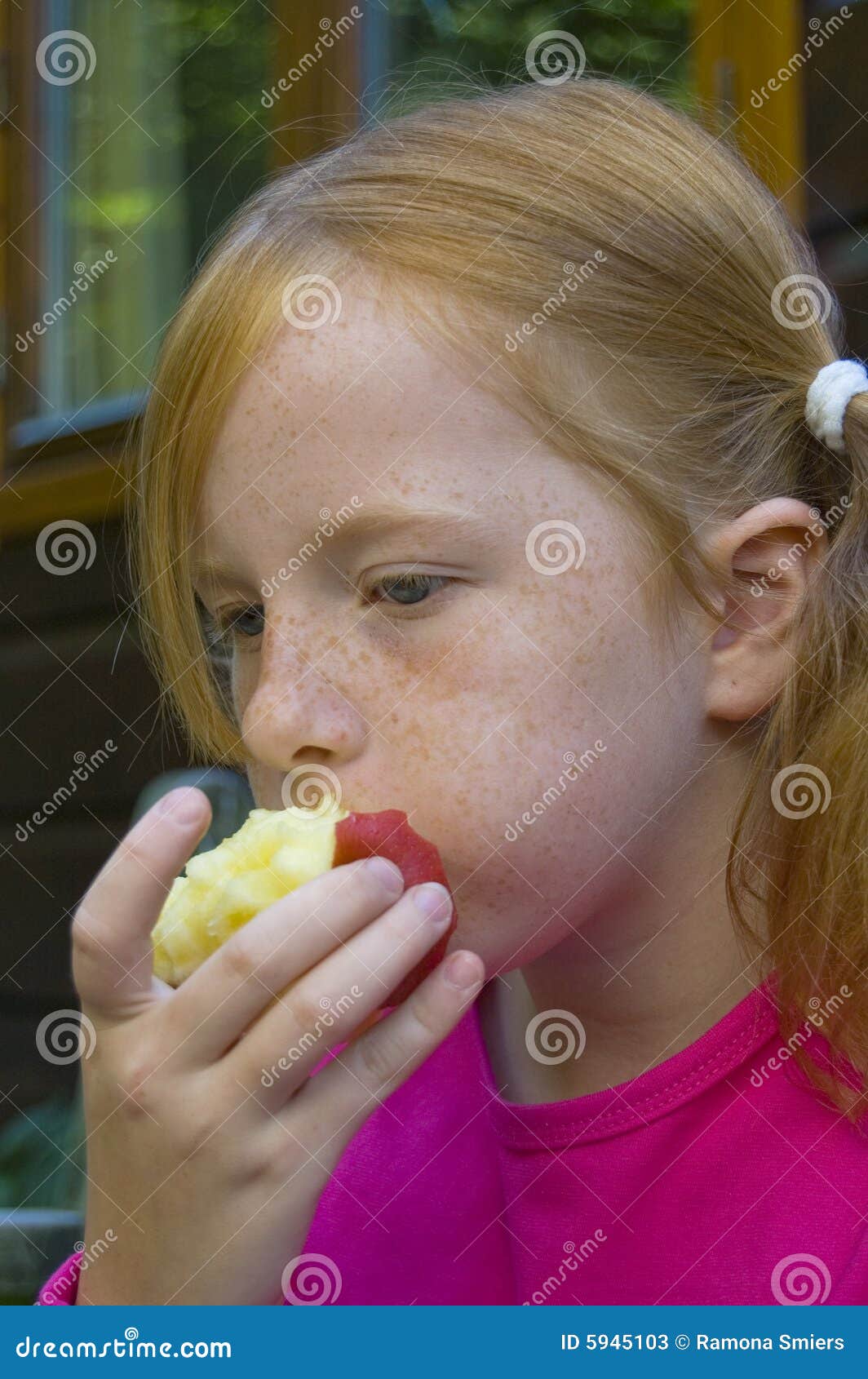 Little girl is eating stock image. Image of freckles, healt - 5945103