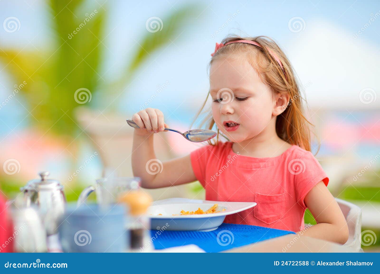 Little Girl Eating Breakfast Royalty Free Stock Photos - Image: 24722588