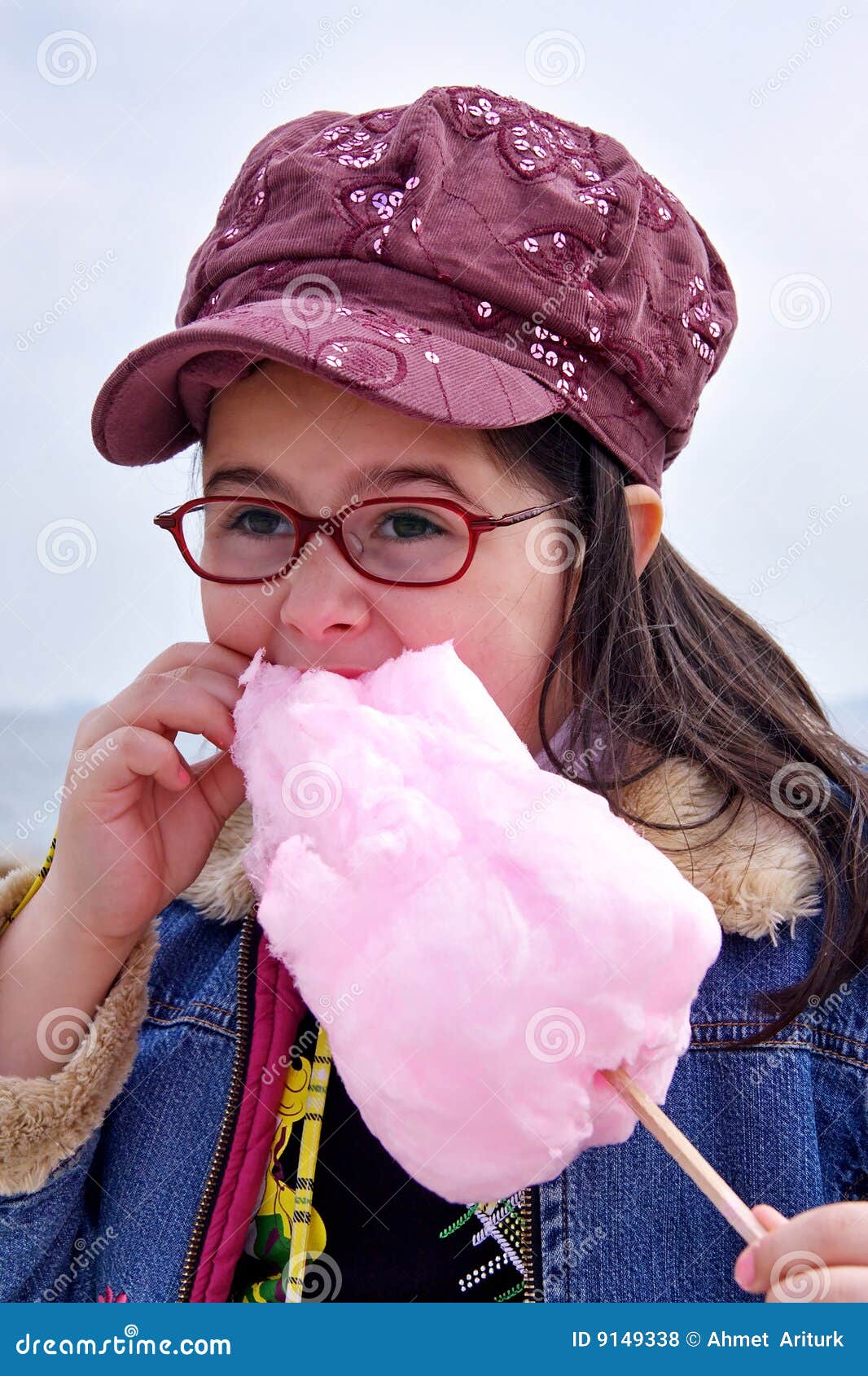 Little girl eating candy stock photo. Image of girl, funny - 9149338