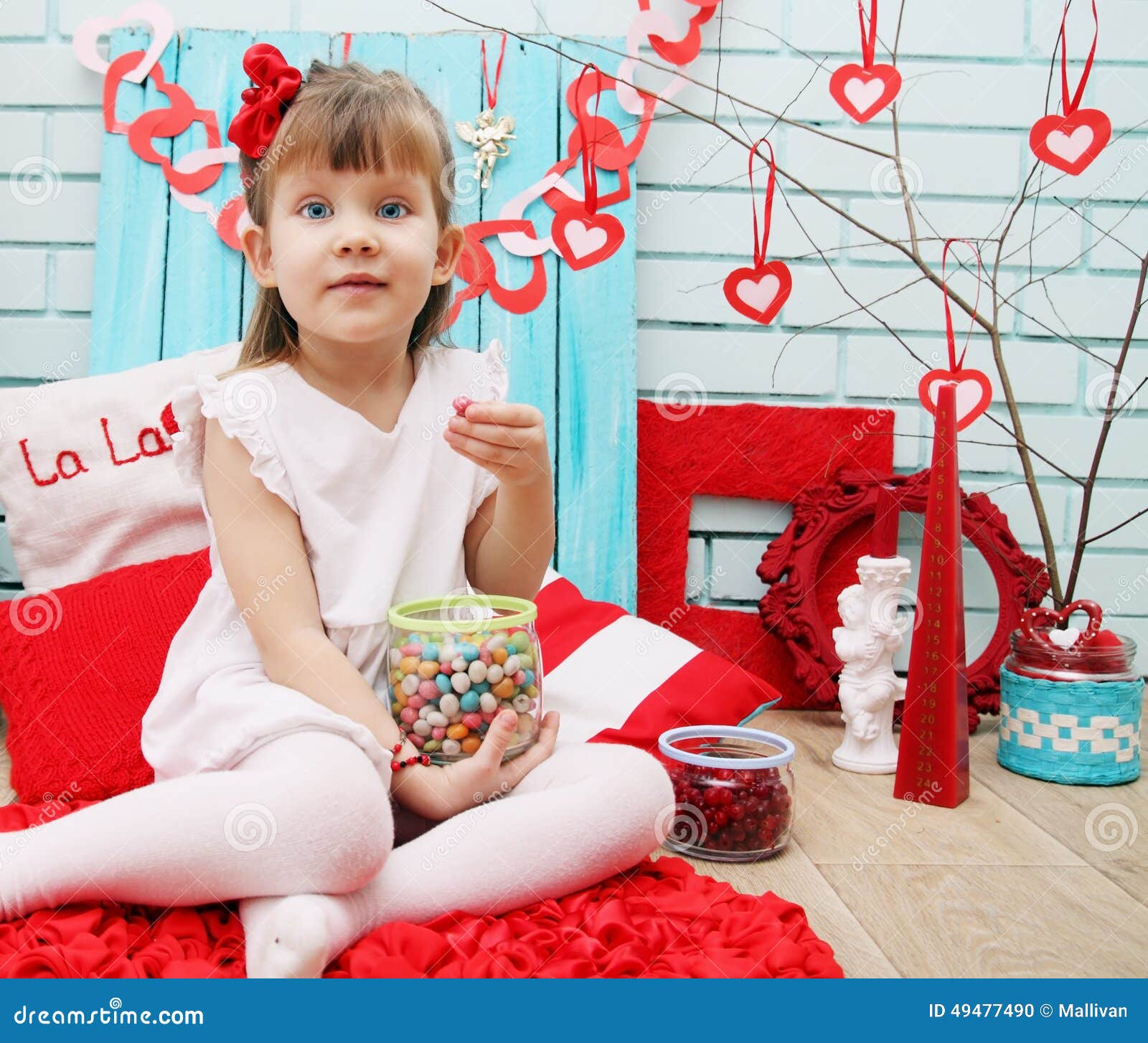 Little girl eating candy stock photo. Image of child - 49477490