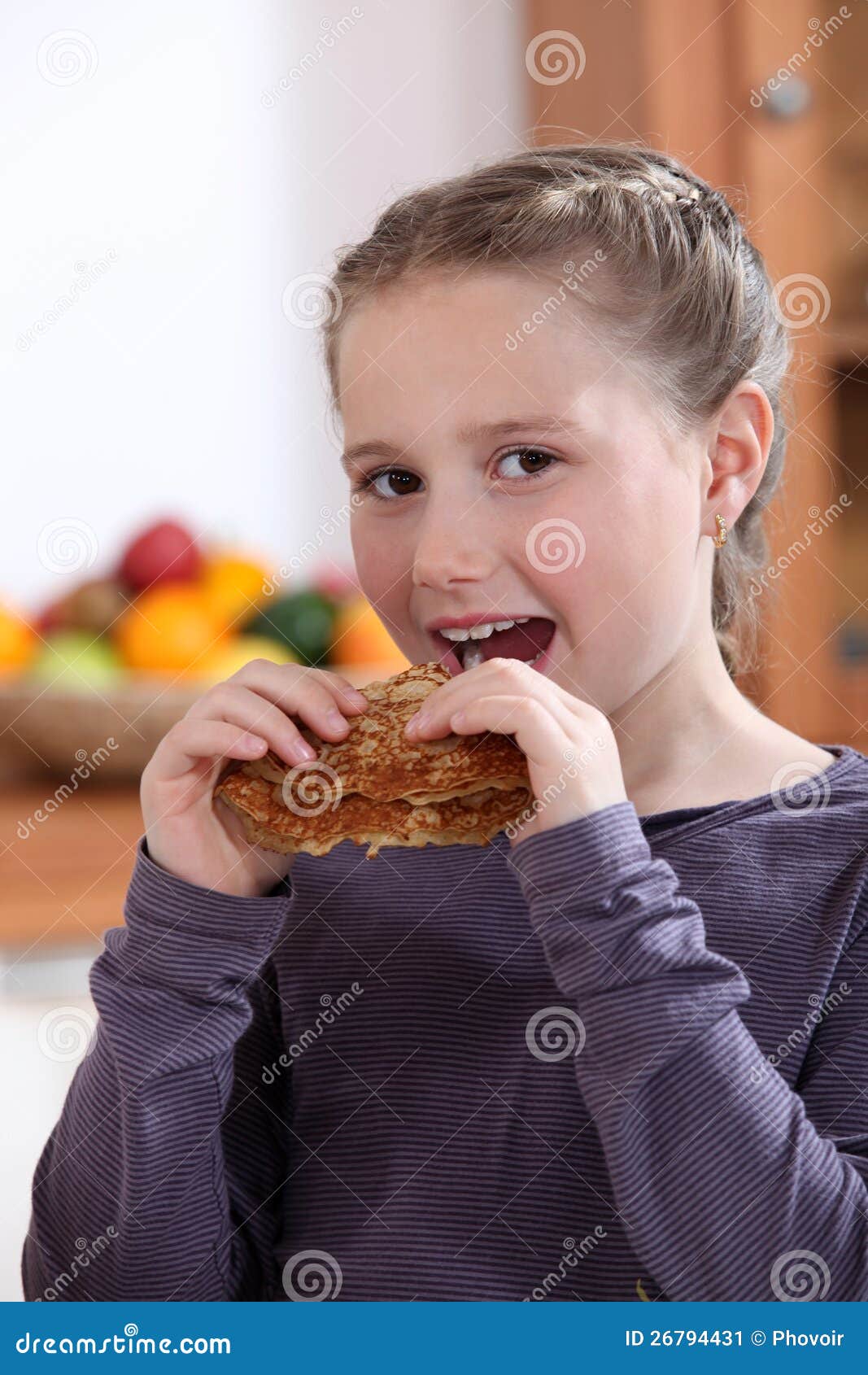 Little girl eating a crepe stock image. Image of enjoyment - 26794431