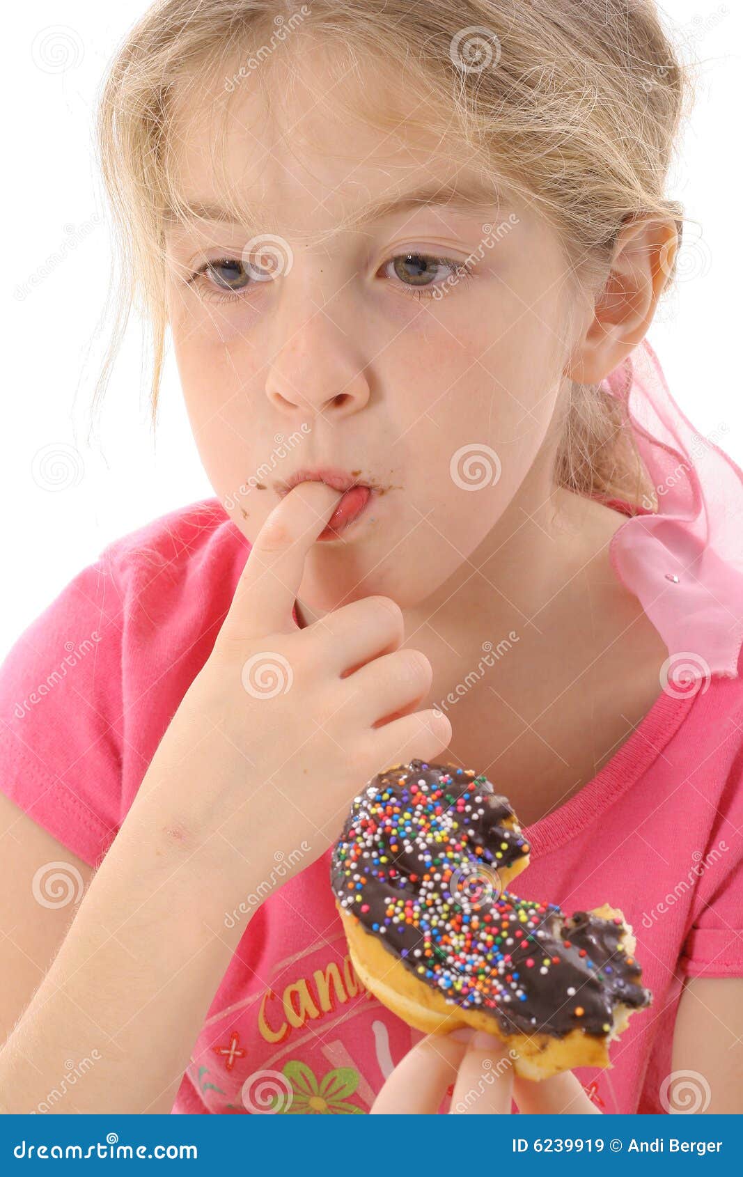 Little Girl Eating a Doughnut Stock Image - Image of hungry, devour ...