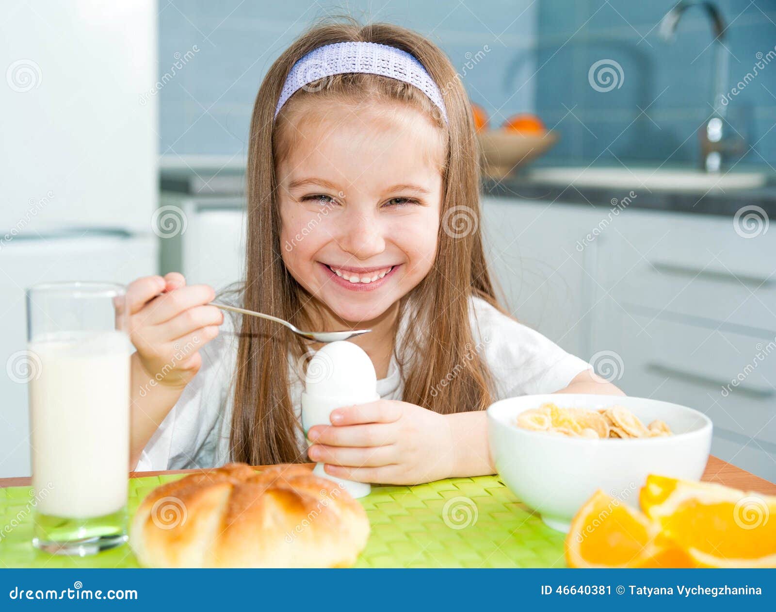 Little Girl Eating Her Breakfast Stock Image - Image of cheerful ...