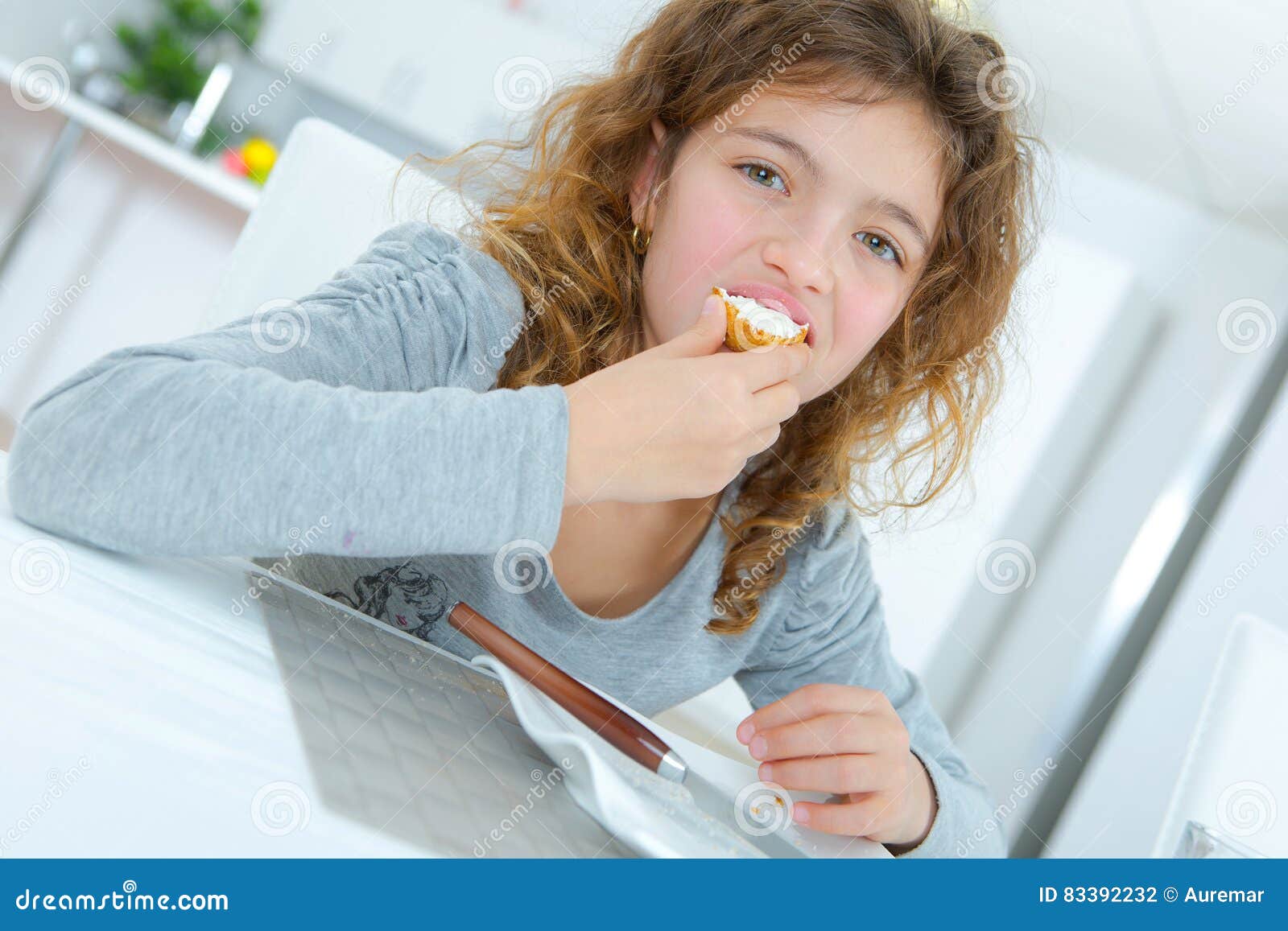 Little Girl Eating Snack in Kitchen Stock Photo - Image of people ...