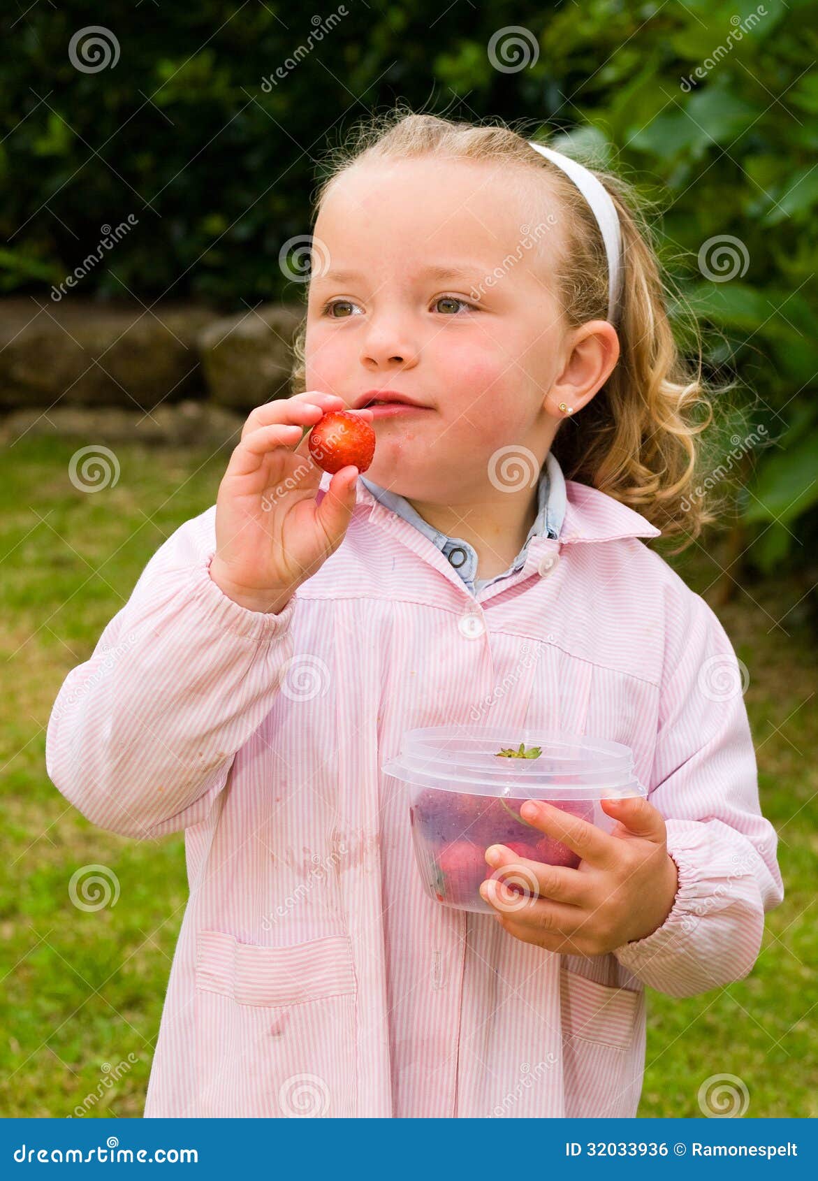 Little Girl Eating Strawberries Stock Photo - Image of container ...