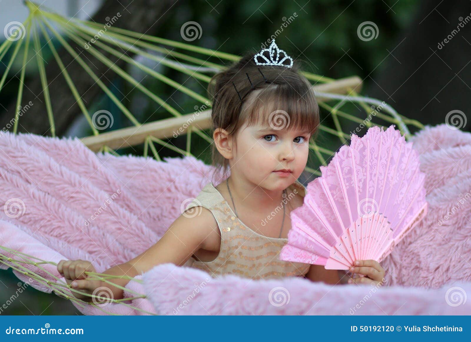 The little girl with a fan stock photo. Image of holding - 50192120