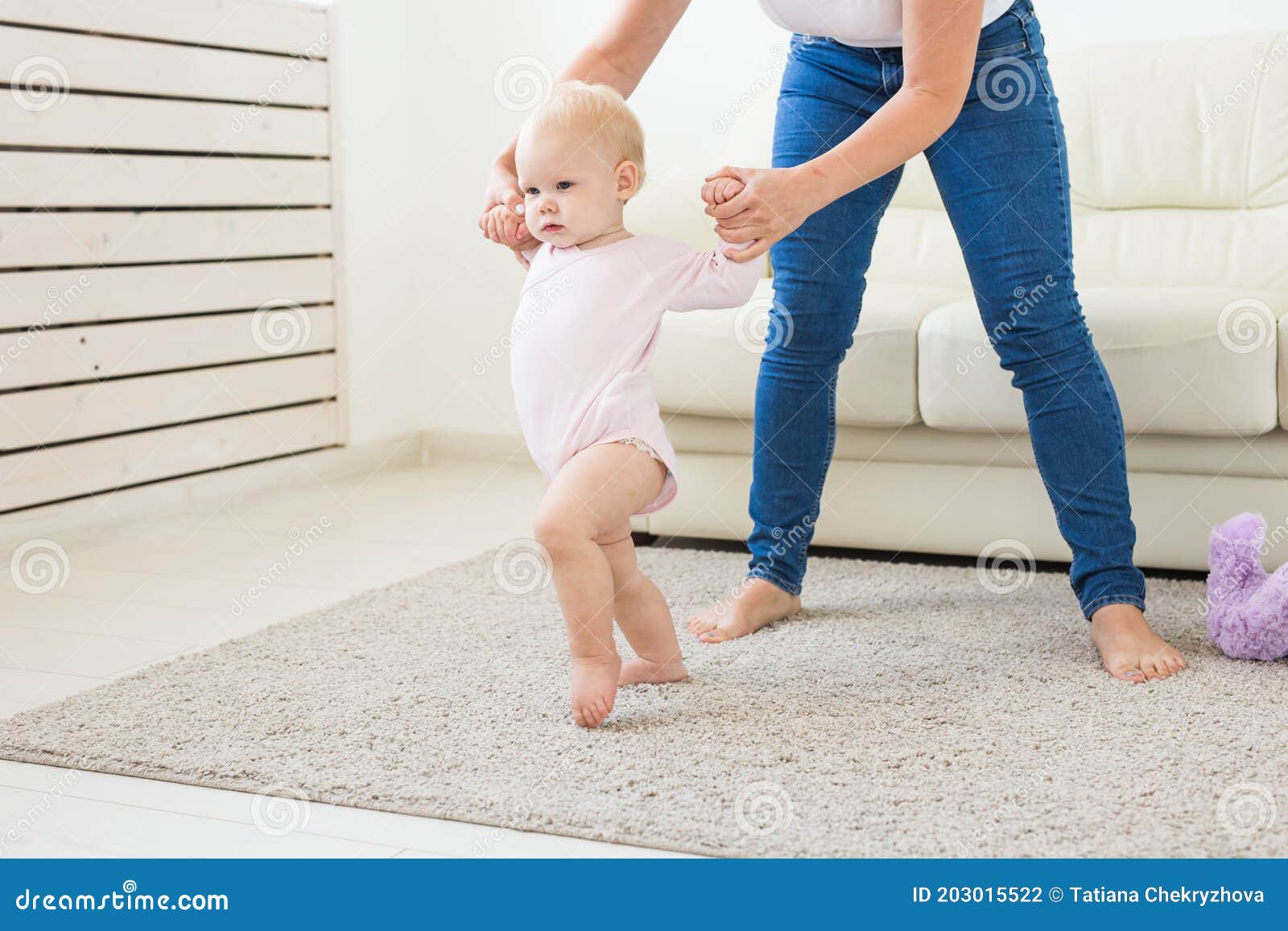 Little Baby Girl First Steps with the Help of Mom Stock Photo - Image ...
