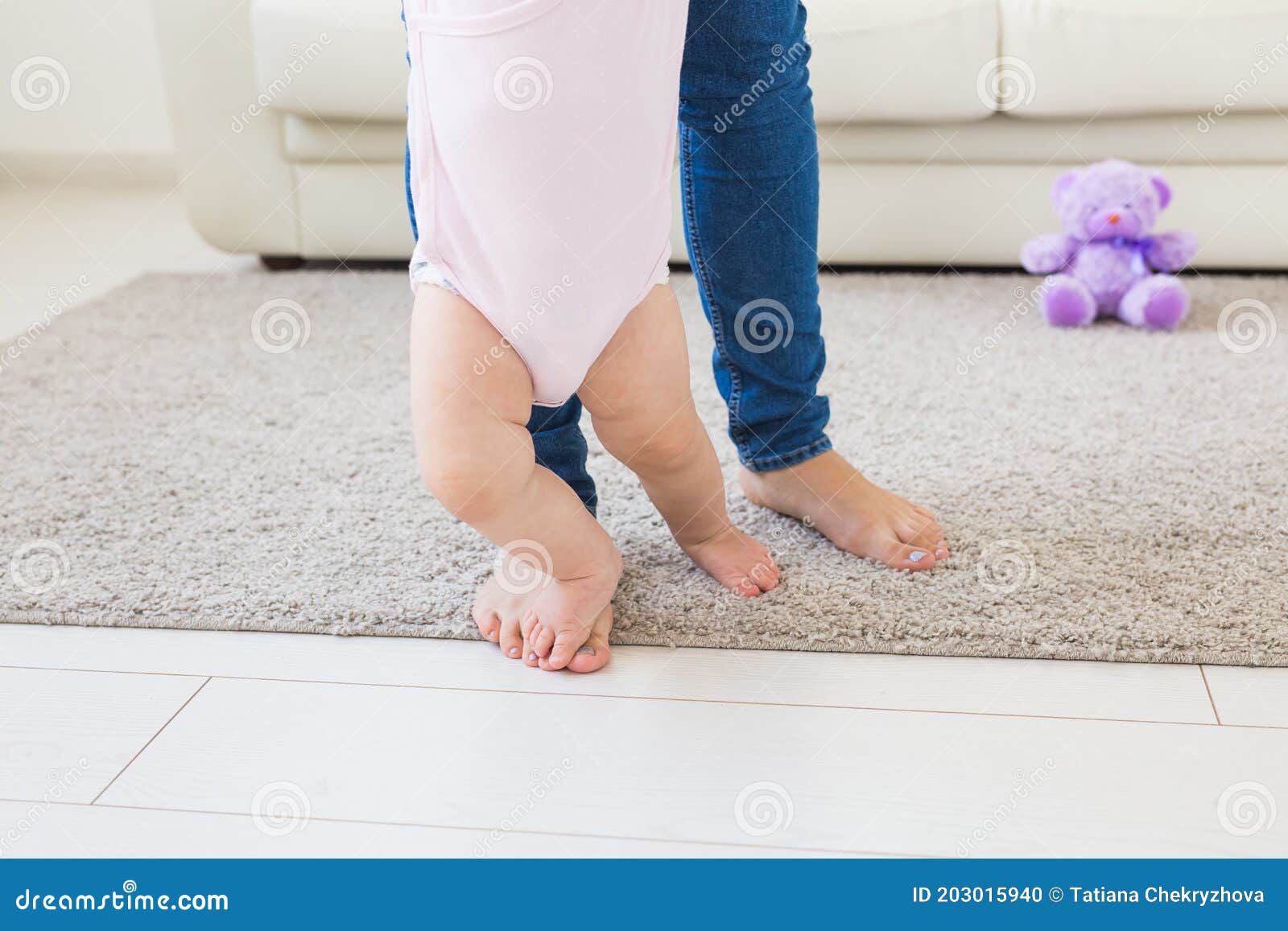 Little Baby Girl First Steps with the Help of Mom Stock Photo - Image ...