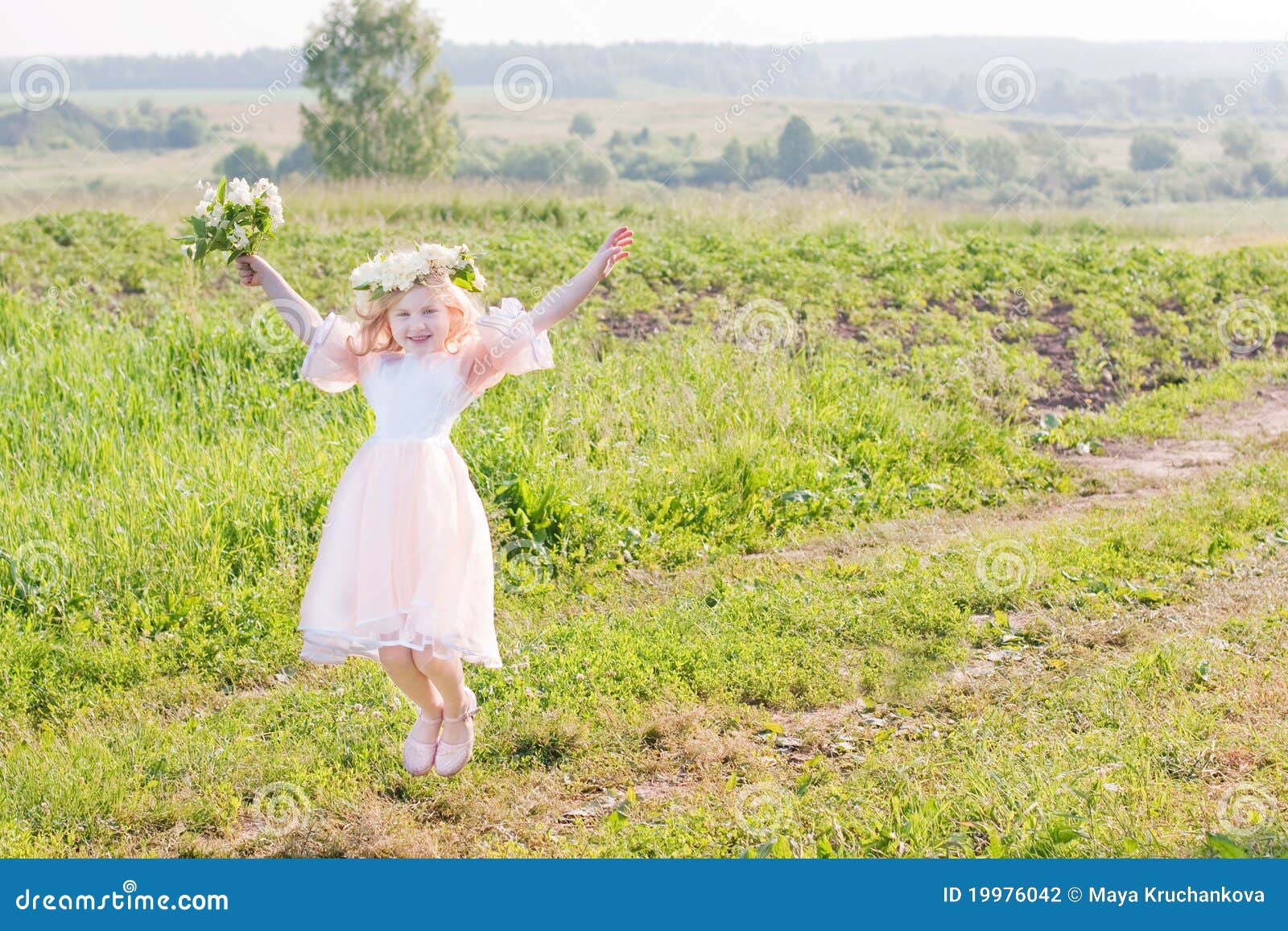 Little girl with flowers stock photo. Image of happy - 19976042