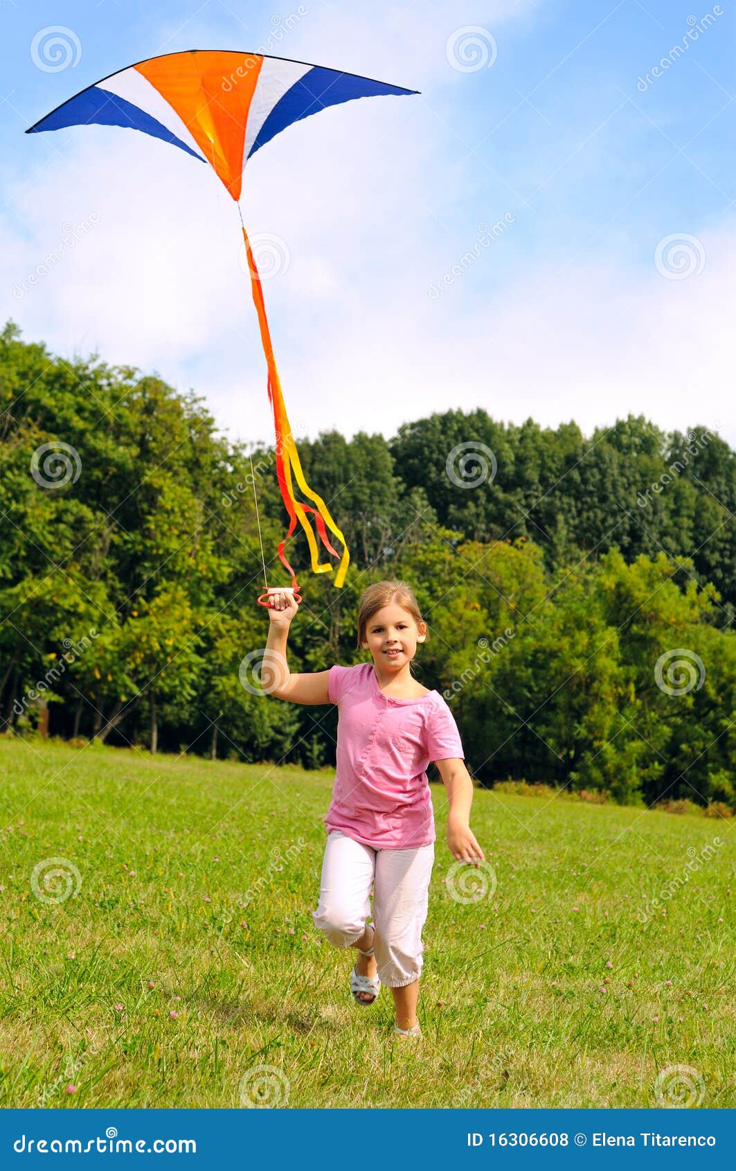 Little girl flying a kite stock photo. Image of handsome - 16306608