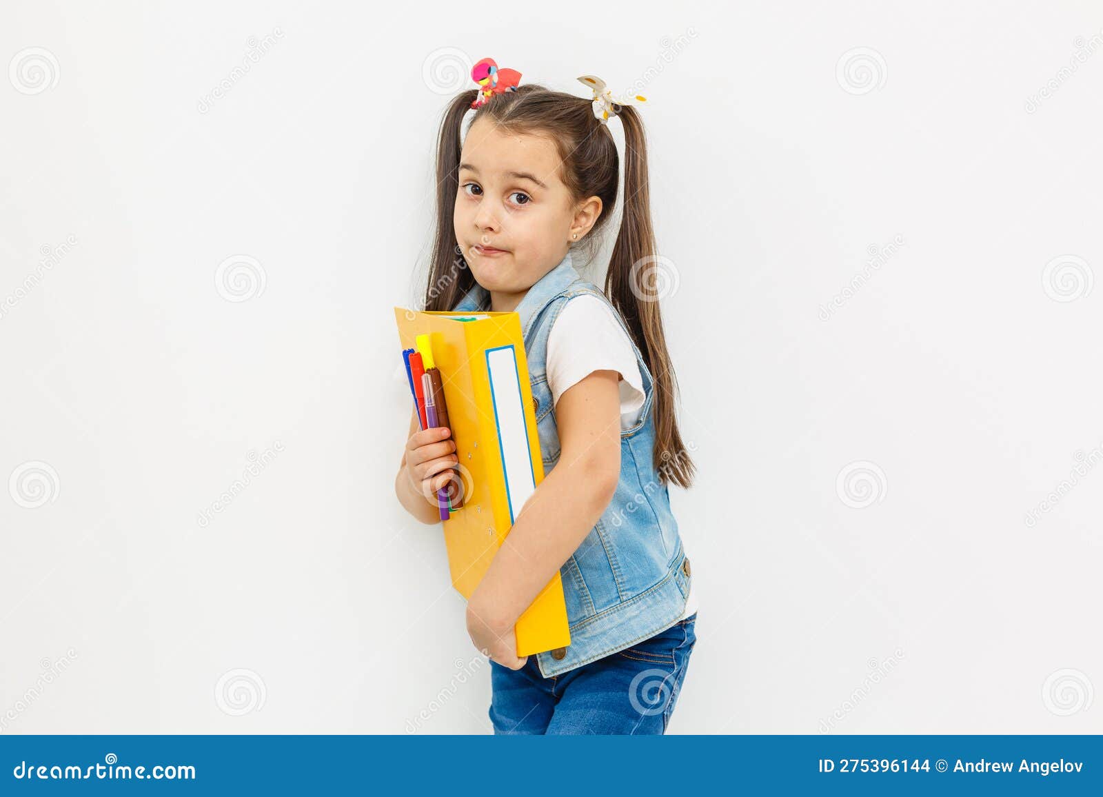 A Little Girl with a Folder and Pens Stock Photo - Image of expression ...