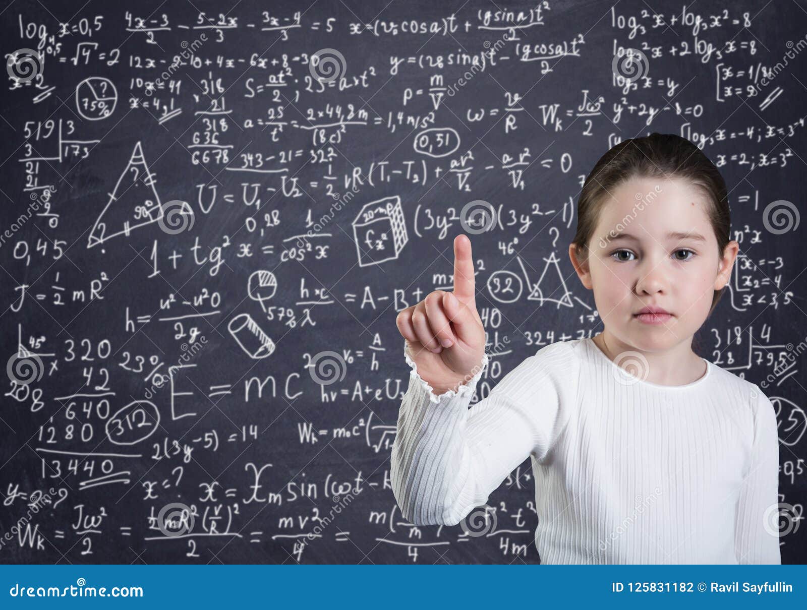 A Little Girl in Front of the Blackboard with Formulas and Calculations ...