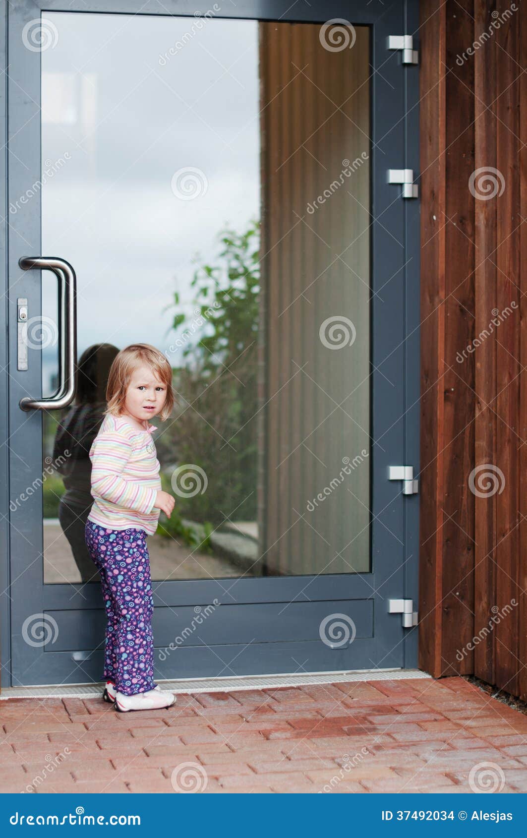 Little Girl in Front of the Door Stock Photo - Image of inside, people ...