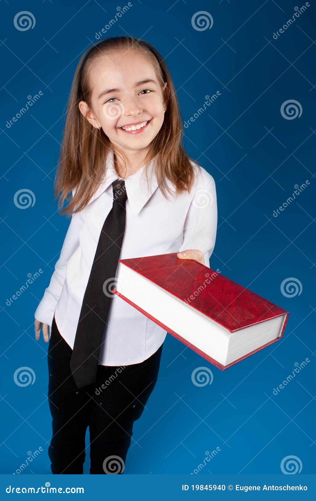 Little girl giving a book stock photo. Image of giving - 19845940