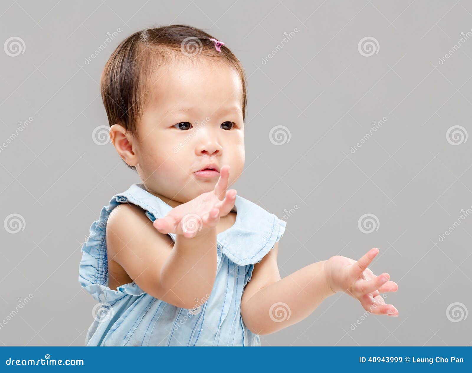 Little Girl With Hand Posture Stock Photo | CartoonDealer.com #40943999