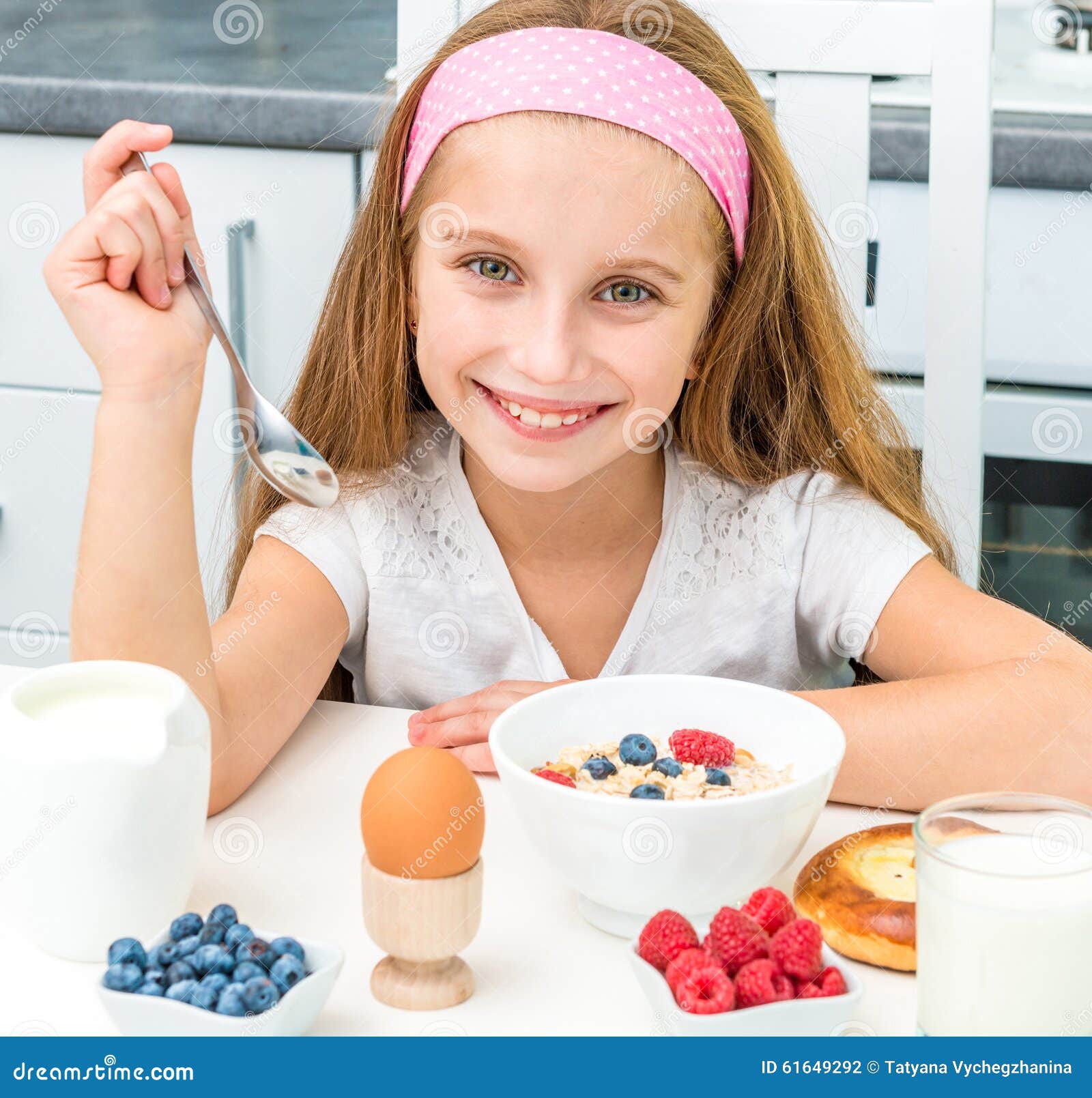 Little Girl Having Breakfast Stock Photo - Image of fruit, health: 61649292