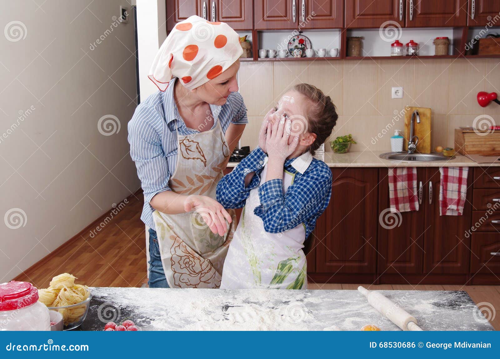 Little Girl is Helping To Bake in a Messy Kitchen Stock Photo - Image ...
