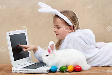 Little Girl with Her Bunny Using Computer Together Stock Image - Image ...