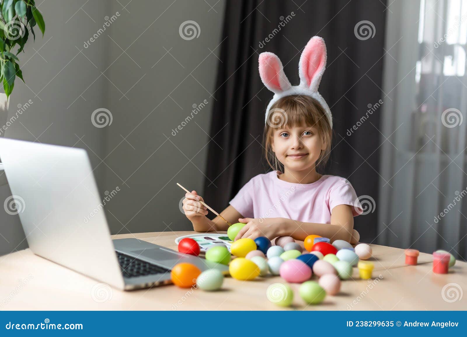 Little Girl with Her Bunny Using Computer Together Preparing for Easter ...