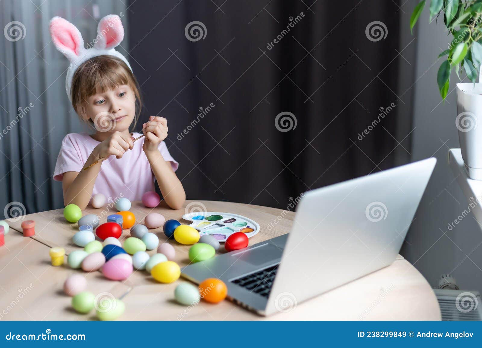 Little Girl with Her Bunny Using Computer Together Preparing for Easter ...
