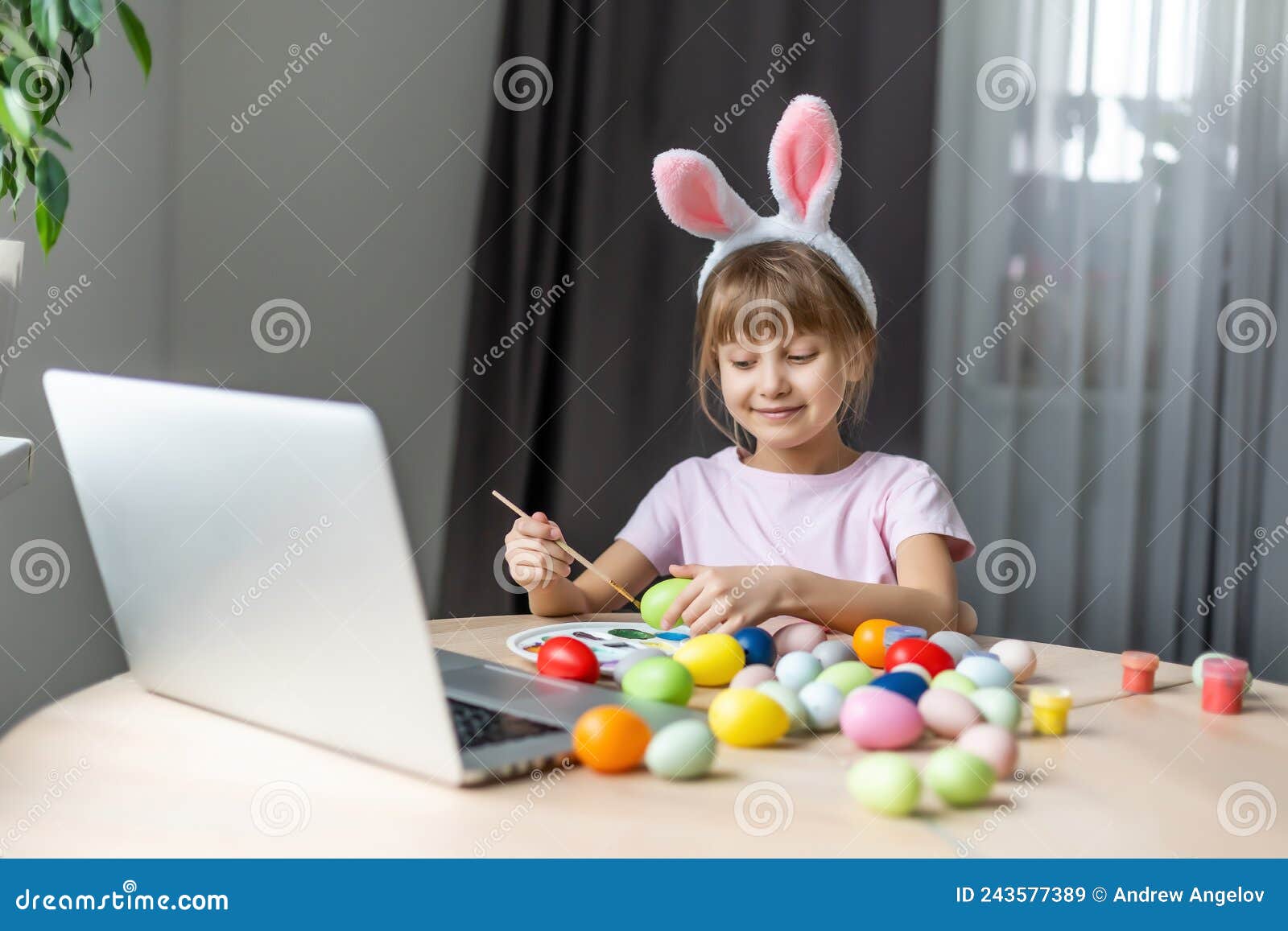 Little Girl with Her Bunny Using Computer Together Preparing for Easter ...