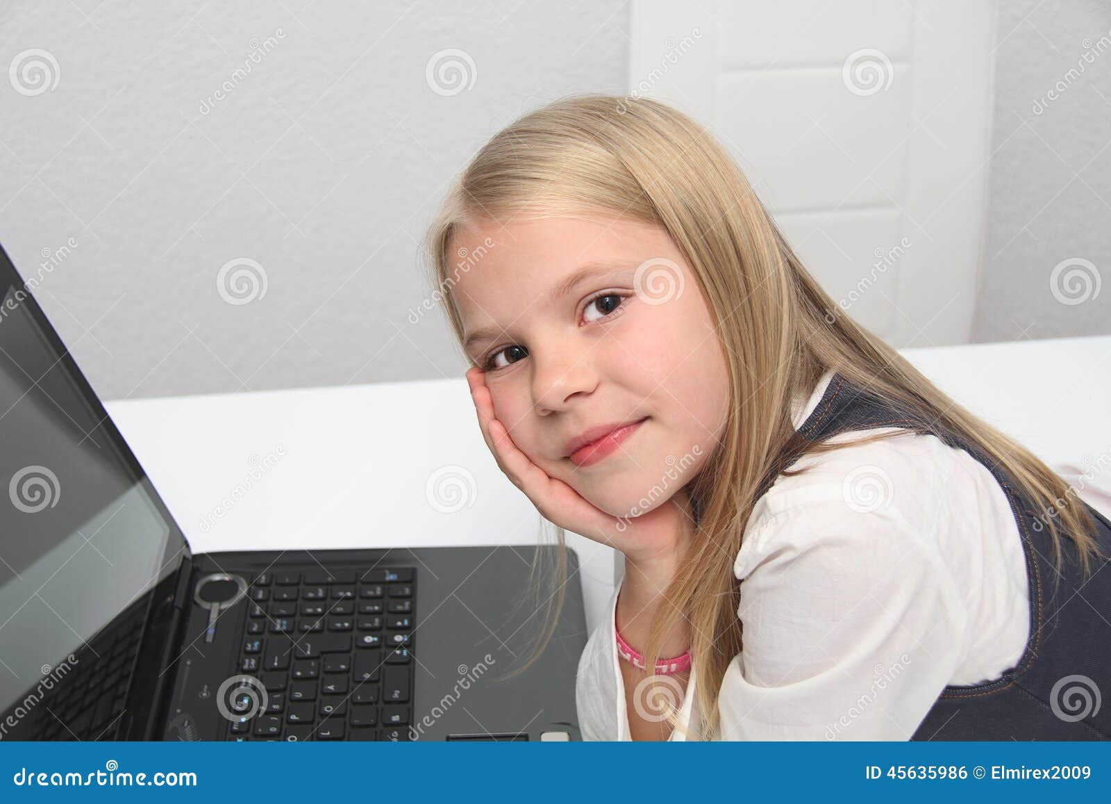 Little Girl with Her Computer at Home at the Table Stock Photo - Image ...
