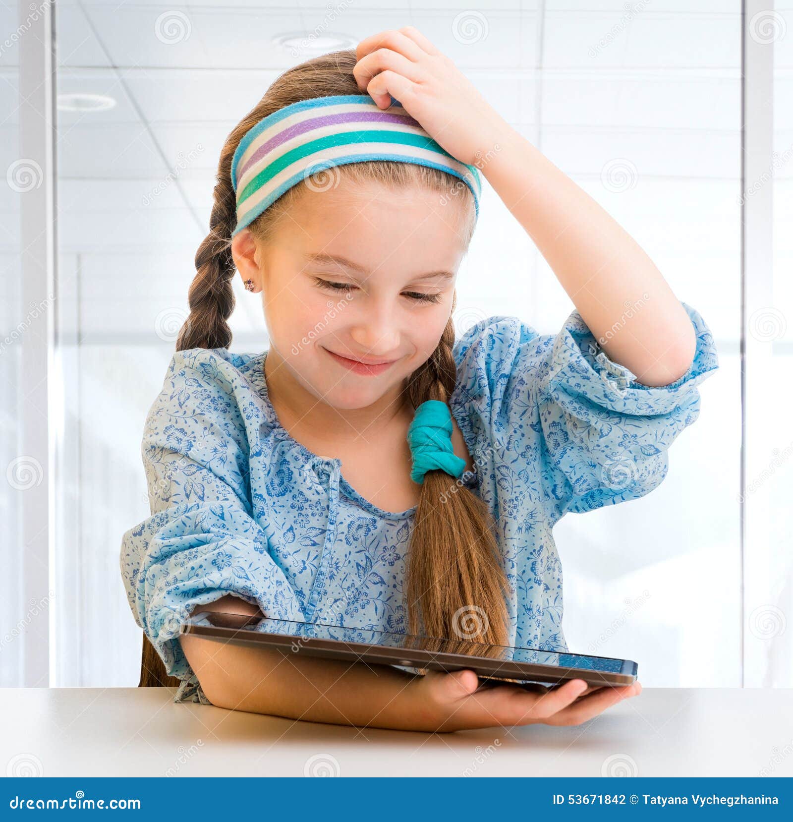 Little girl and her tablet stock photo. Image of laptop - 53671842