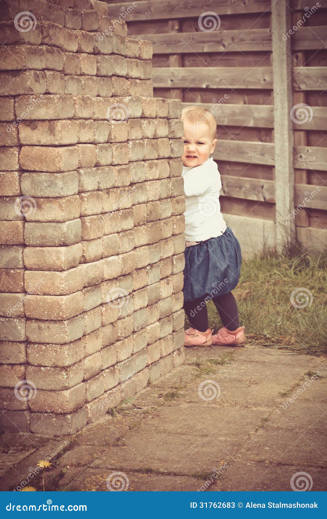 Little girl hiding stock image. Image of expression, girl - 31762683