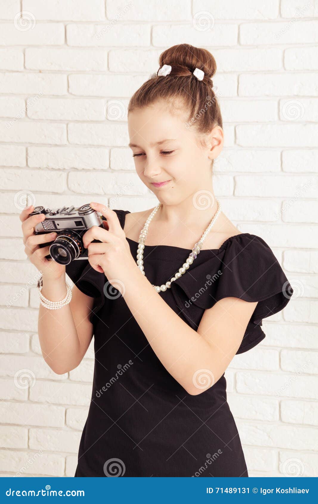 Little Girl Holding a Camera Stock Image - Image of people, child: 71489131