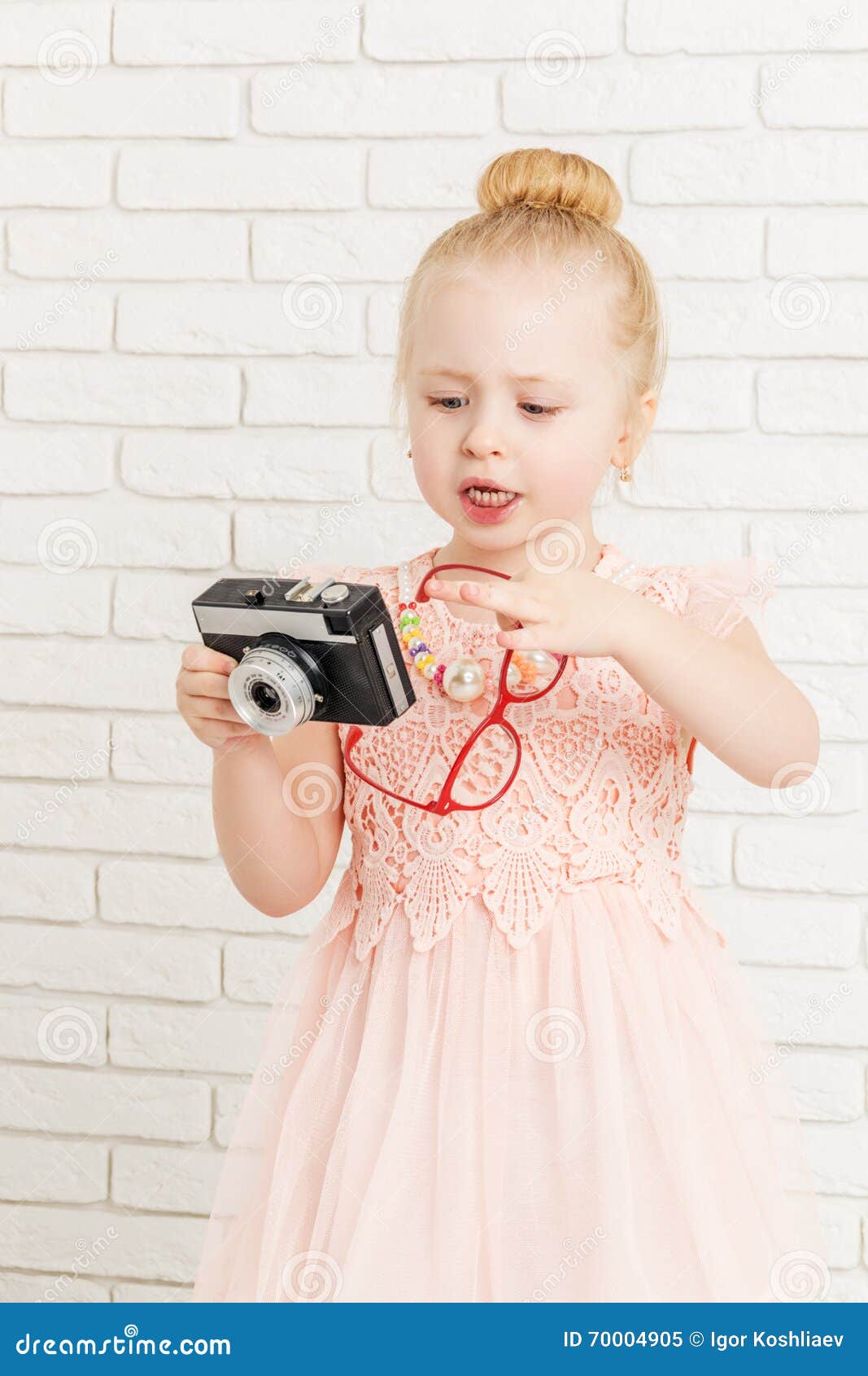 Little Girl Holding a Camera Stock Image - Image of person, female ...