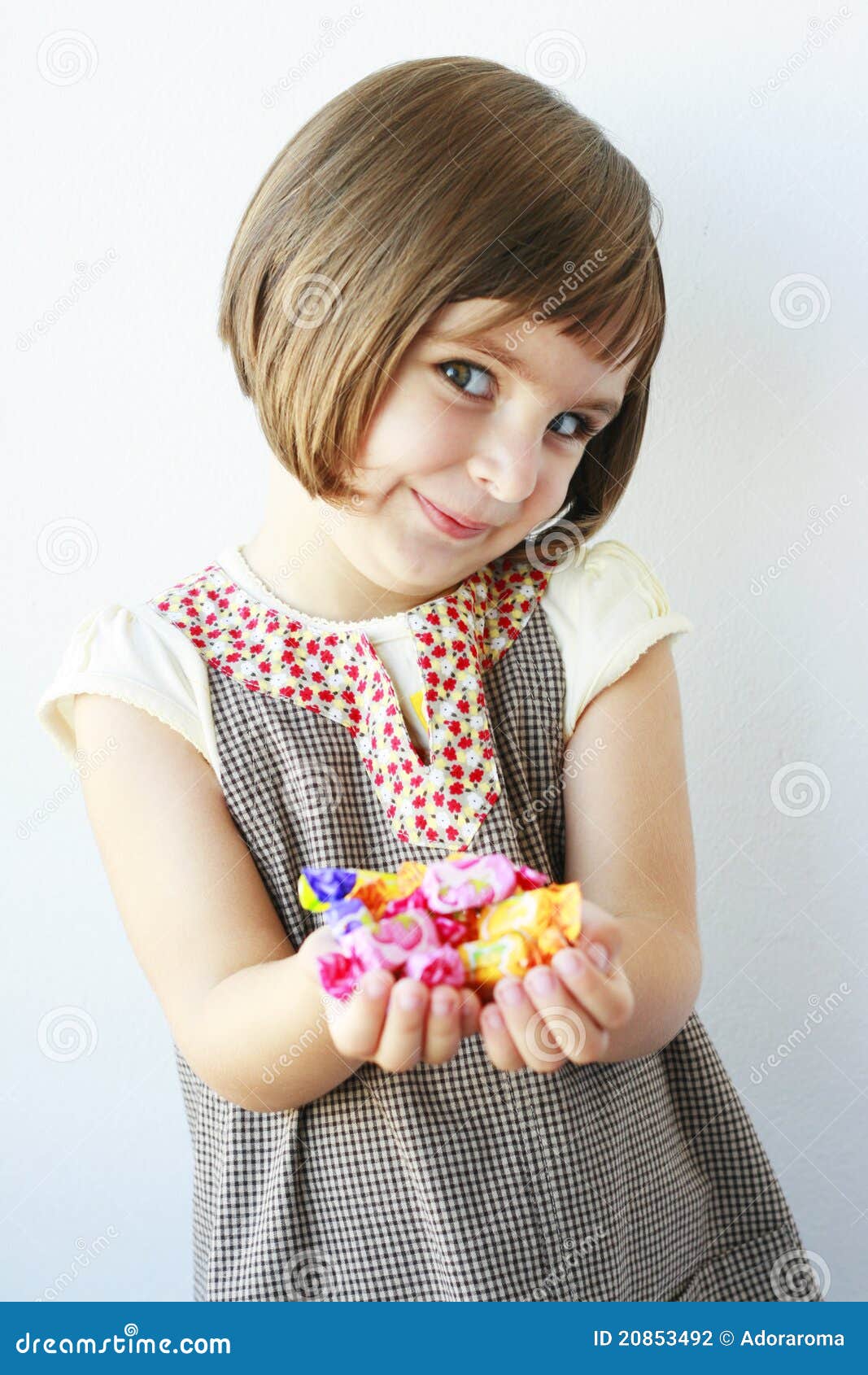 Little Girl Holding Candies Stock Photo - Image of child, candy: 20853492