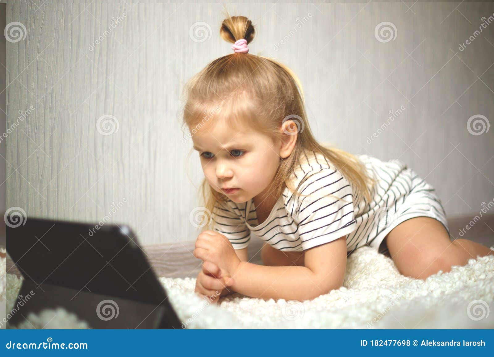 Little Girl at Home Watching Tablet Computer. Home Schooling, Distance ...