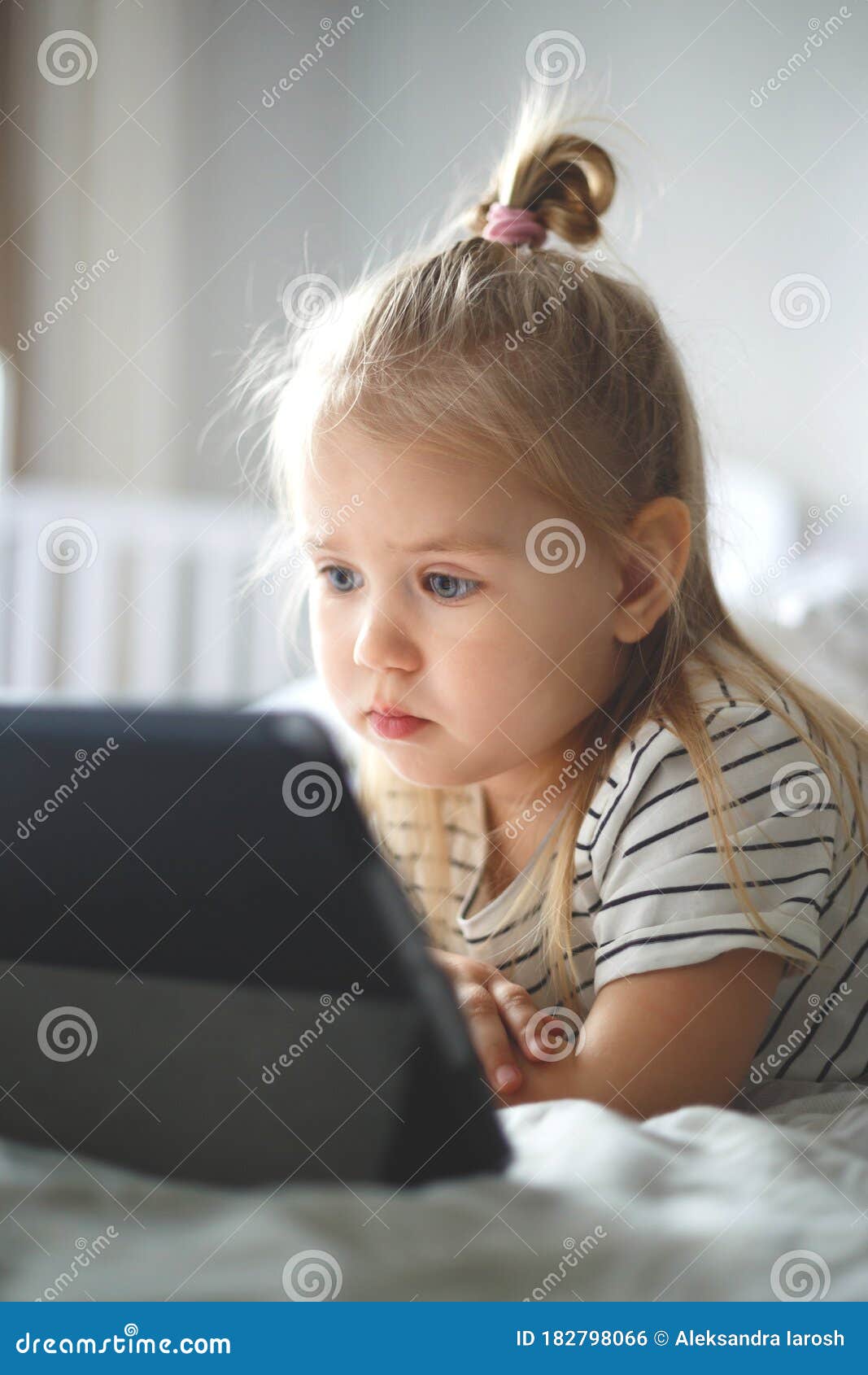 Little Girl at Home Watching Tablet Computer. Home Schooling, Distance ...