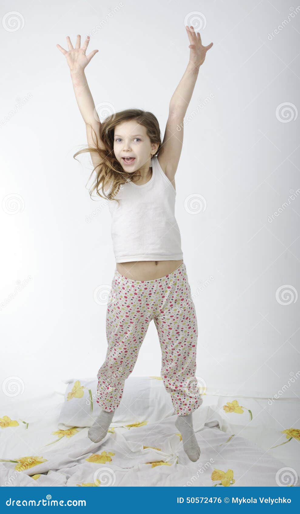 Little Girl Jumping on Bed Isolated Stock Photo - Image of high ...