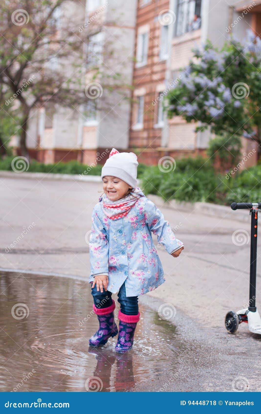 Little Girl Jumping in the Puddle Stock Photo - Image of park, puddle ...