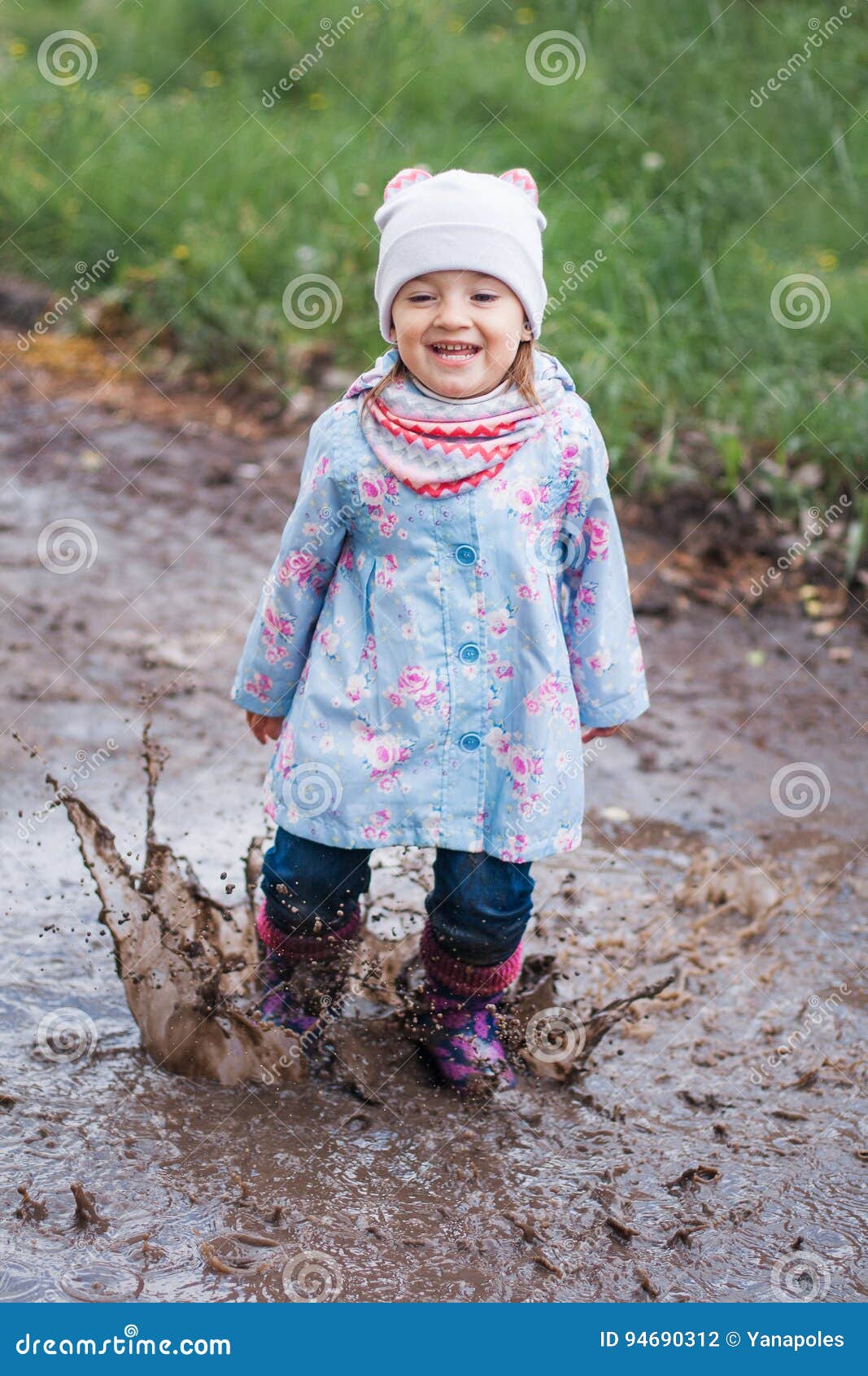 Little Girl Jumping in the Puddle Stock Photo - Image of splash, jump ...