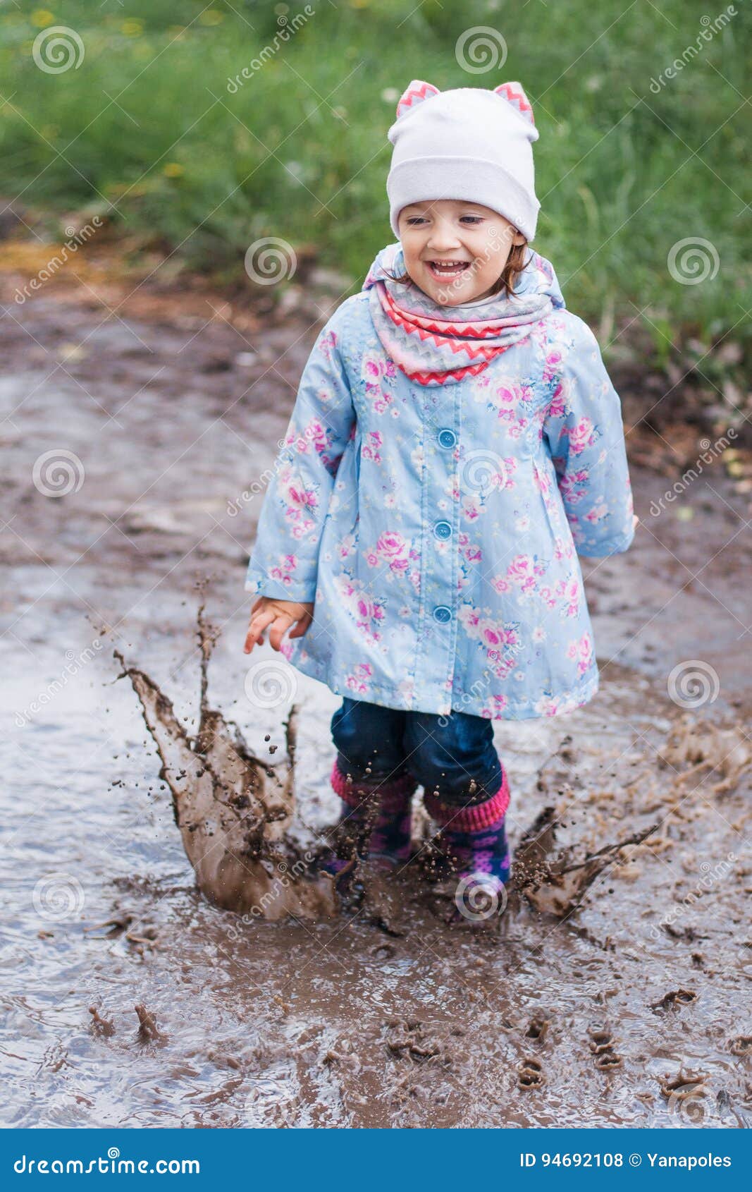 Little Girl Jumping in the Puddle Stock Photo - Image of rain, spring ...