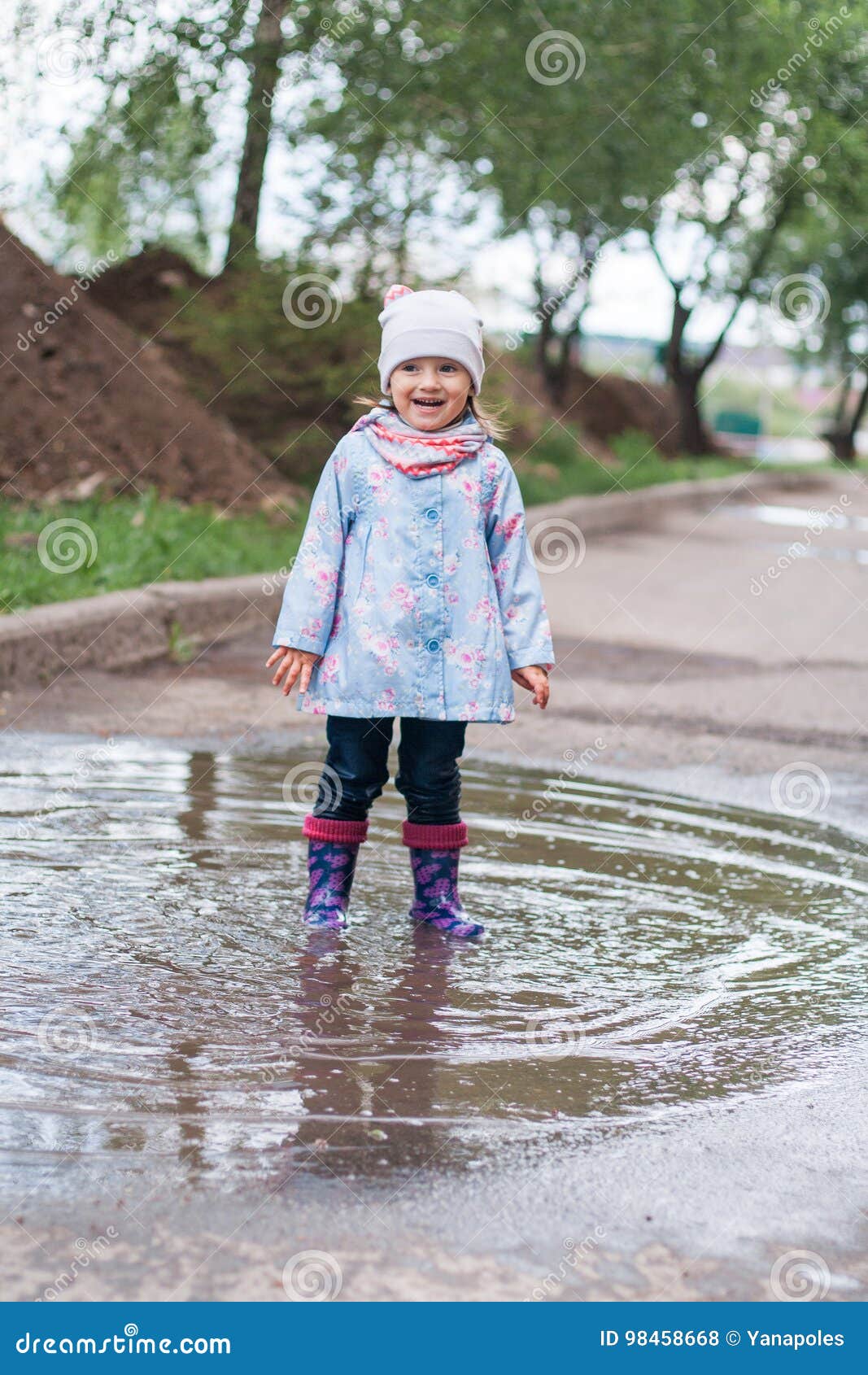 Little Girl Jumping in the Puddle Stock Photo - Image of cute, happy ...