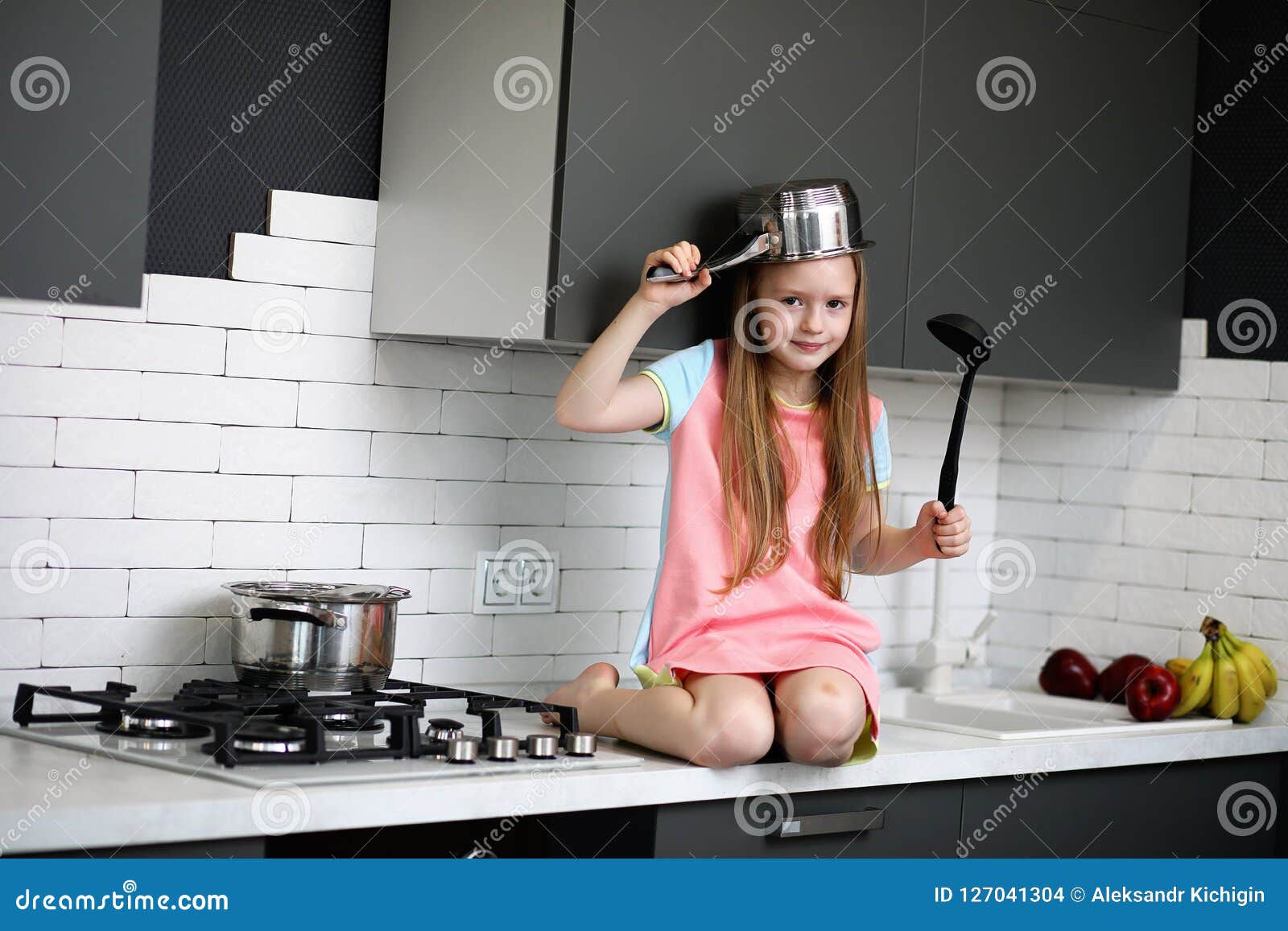 Little girl in the kitchen stock photo. Image of daughter - 127041304