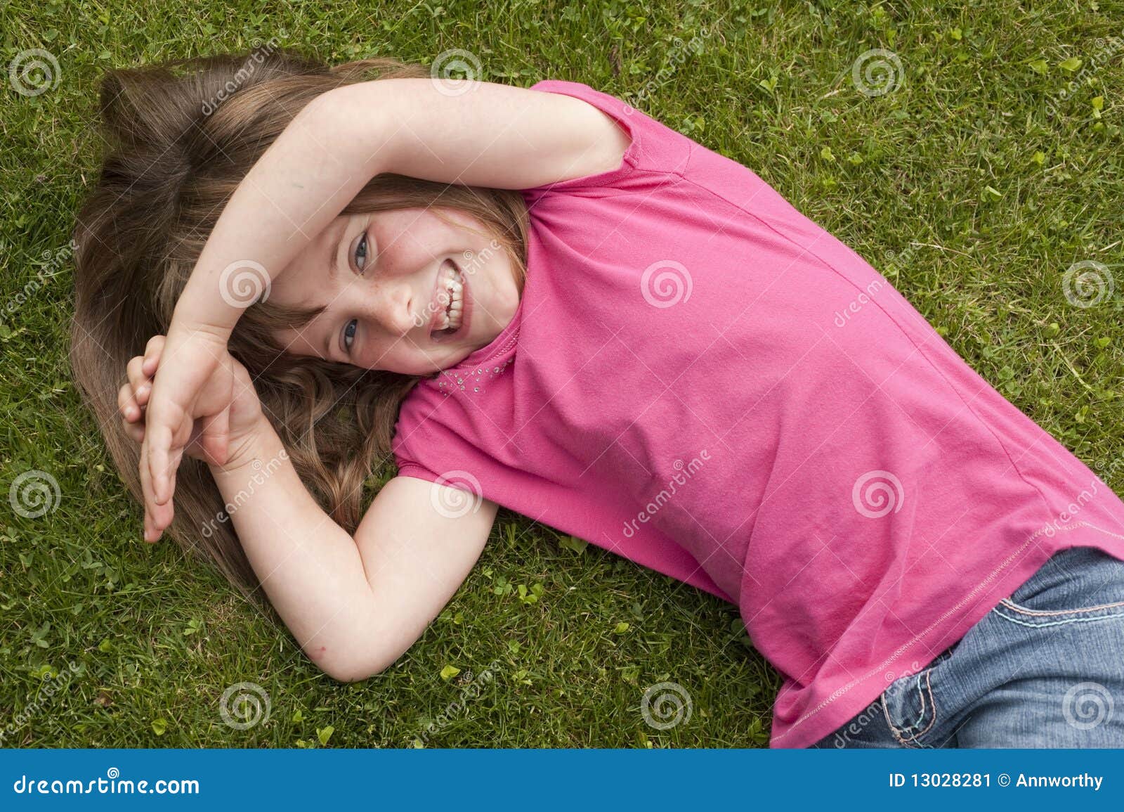 Little Girl Laying In Grass Stock Image - Image: 13028281