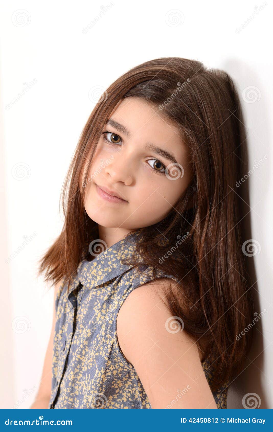 Little Girl Leaning on Wall Stock Photo - Image of clothing, beautiful ...