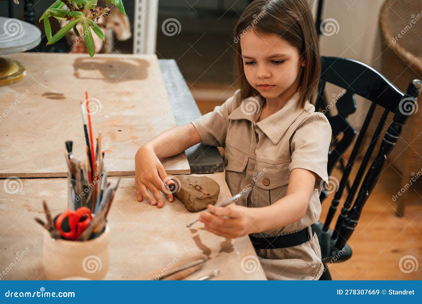Little Girl is Learning How To Do Pottery in the Workshop Stock Image ...