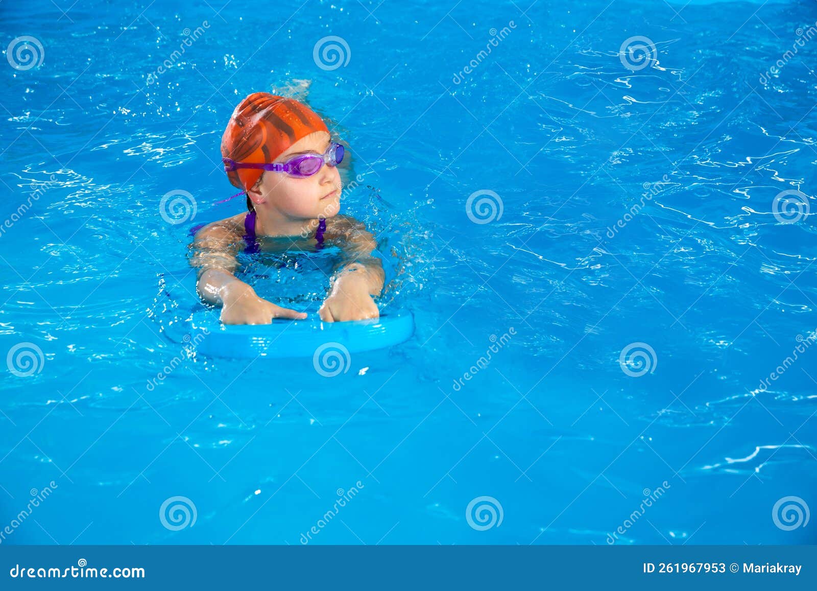 Little Girl Learning How To Swim in a Pool Using Flutterboard with Copy ...