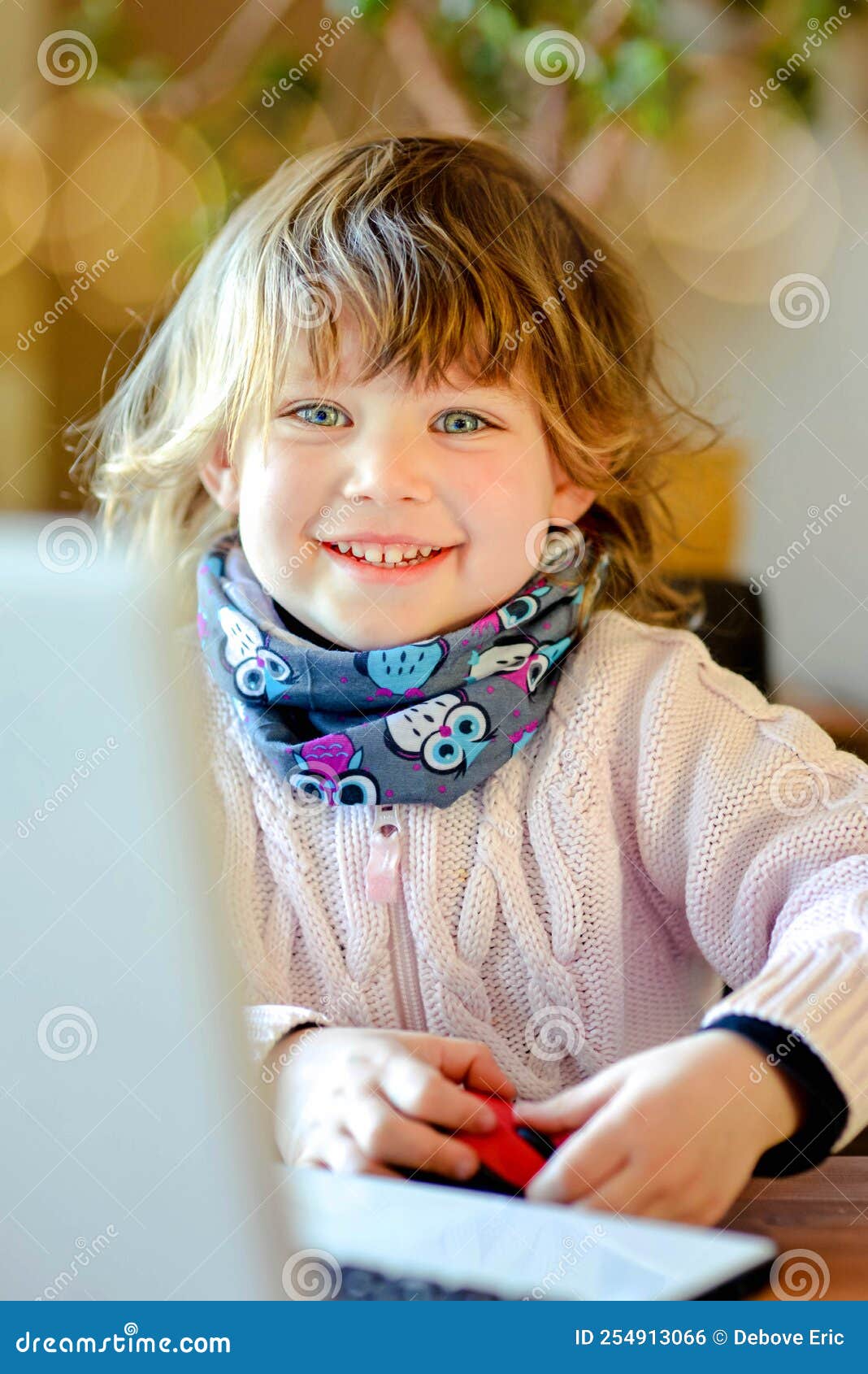 Beautiful Young Girl Playing or Doing Homework on a Laptop Stock Photo ...