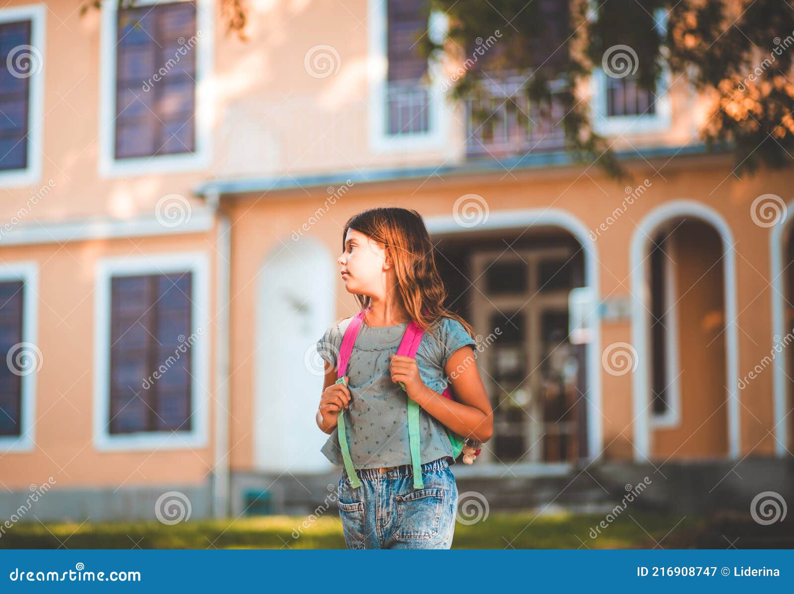 Little girl leaving school stock image. Image of outside - 216908747