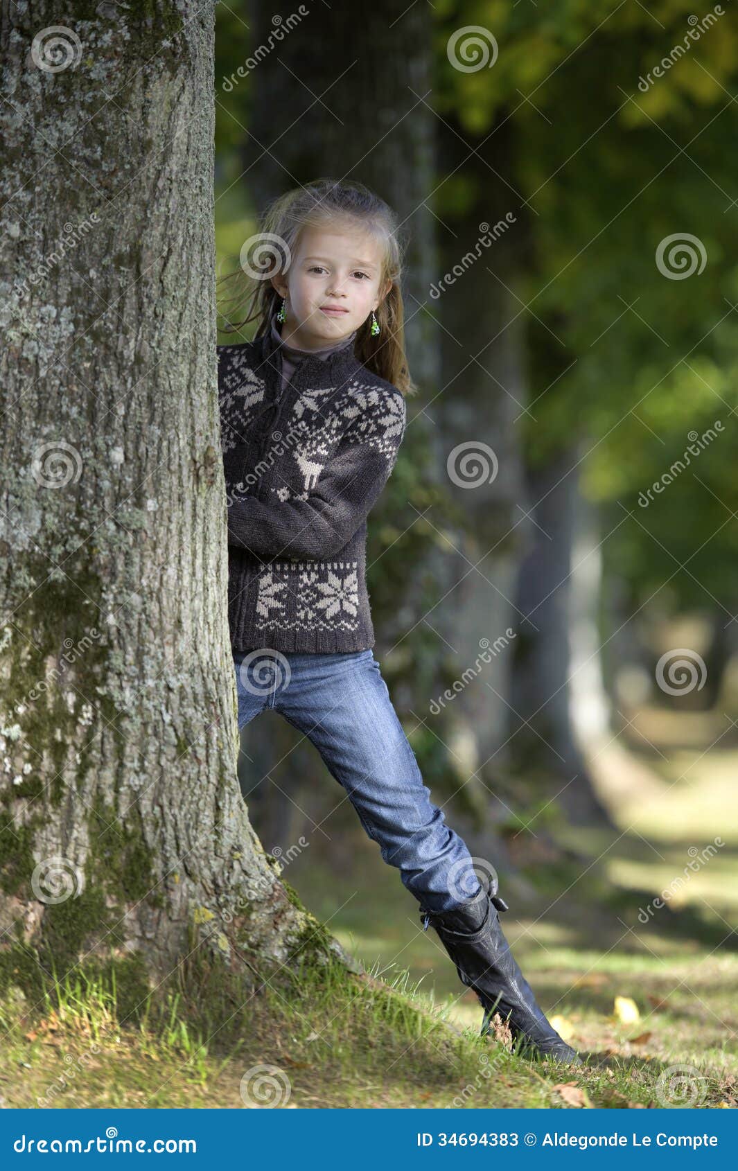Little Girl Looking from Behind a Tree Stock Image - Image of eyes ...